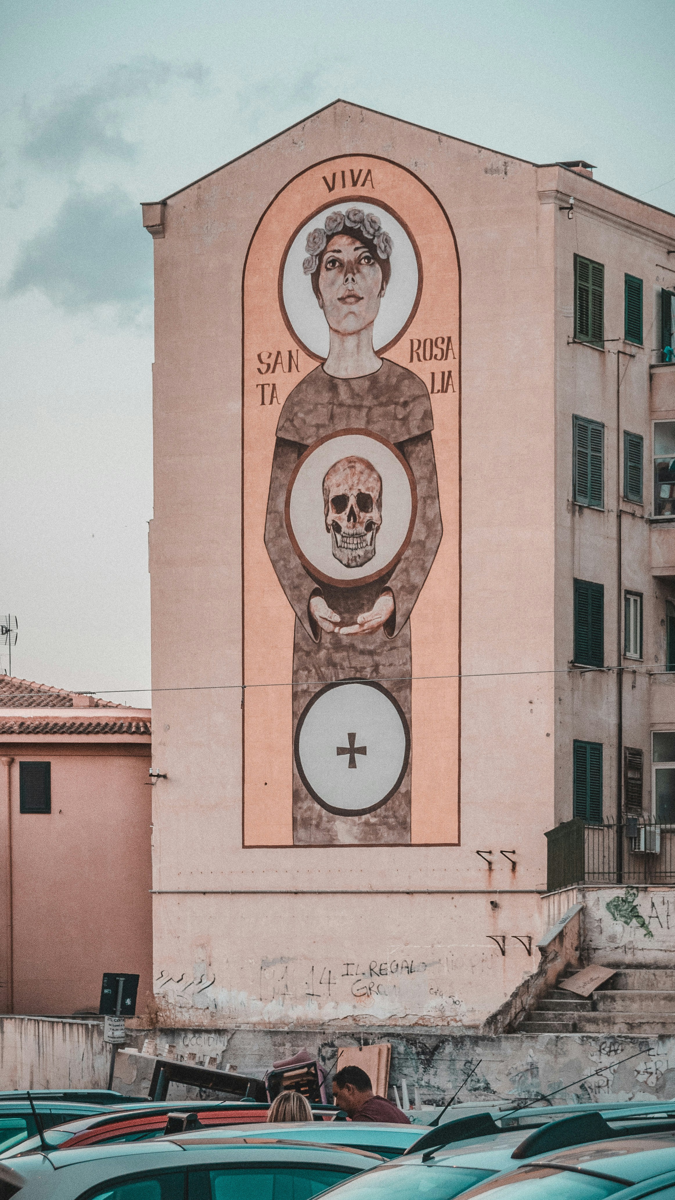 Icon in the Rough: A Statue of Life Beneath a Florid Fresco