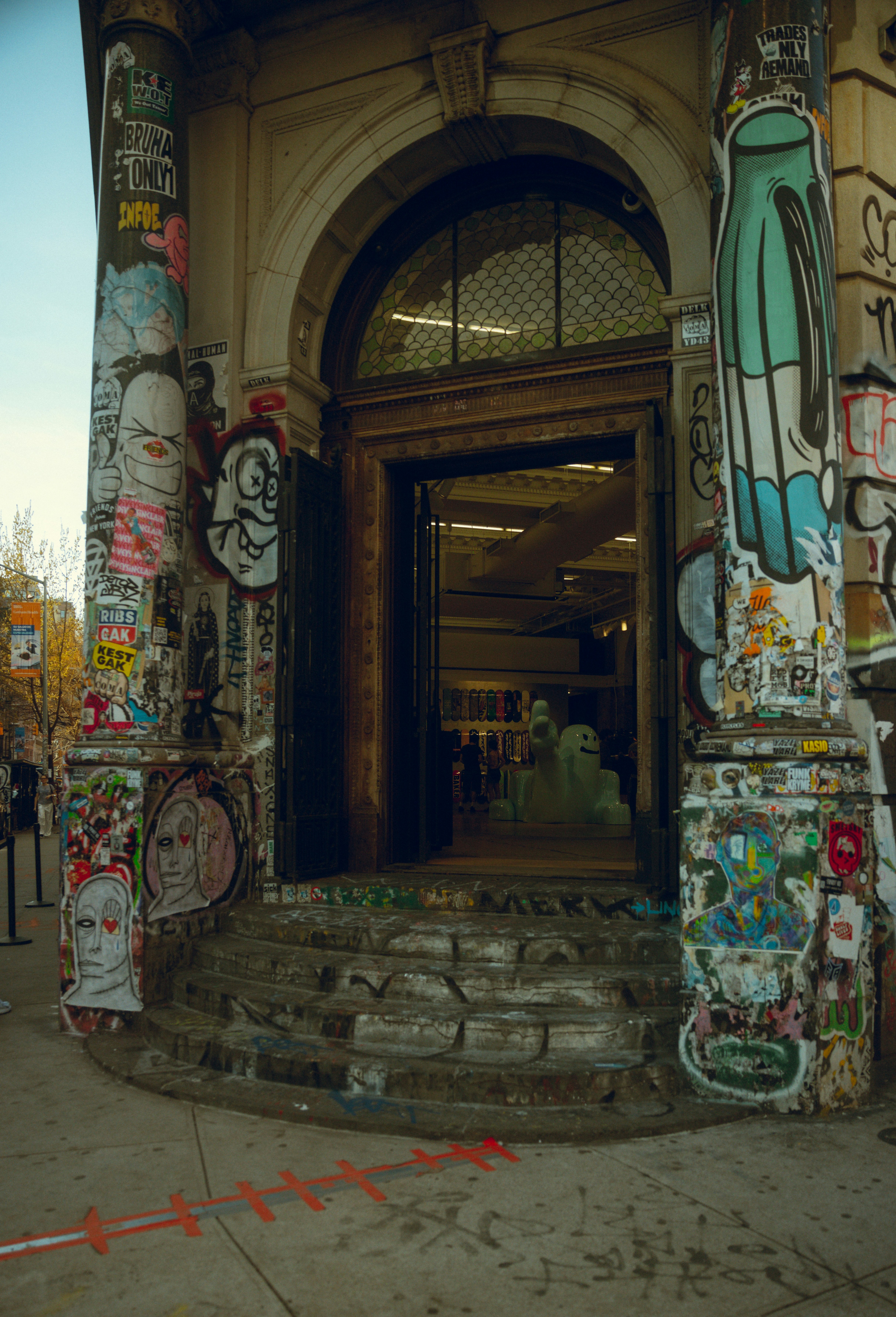 A building with a bunch of graffiti all over it photo – Free Lower east ...