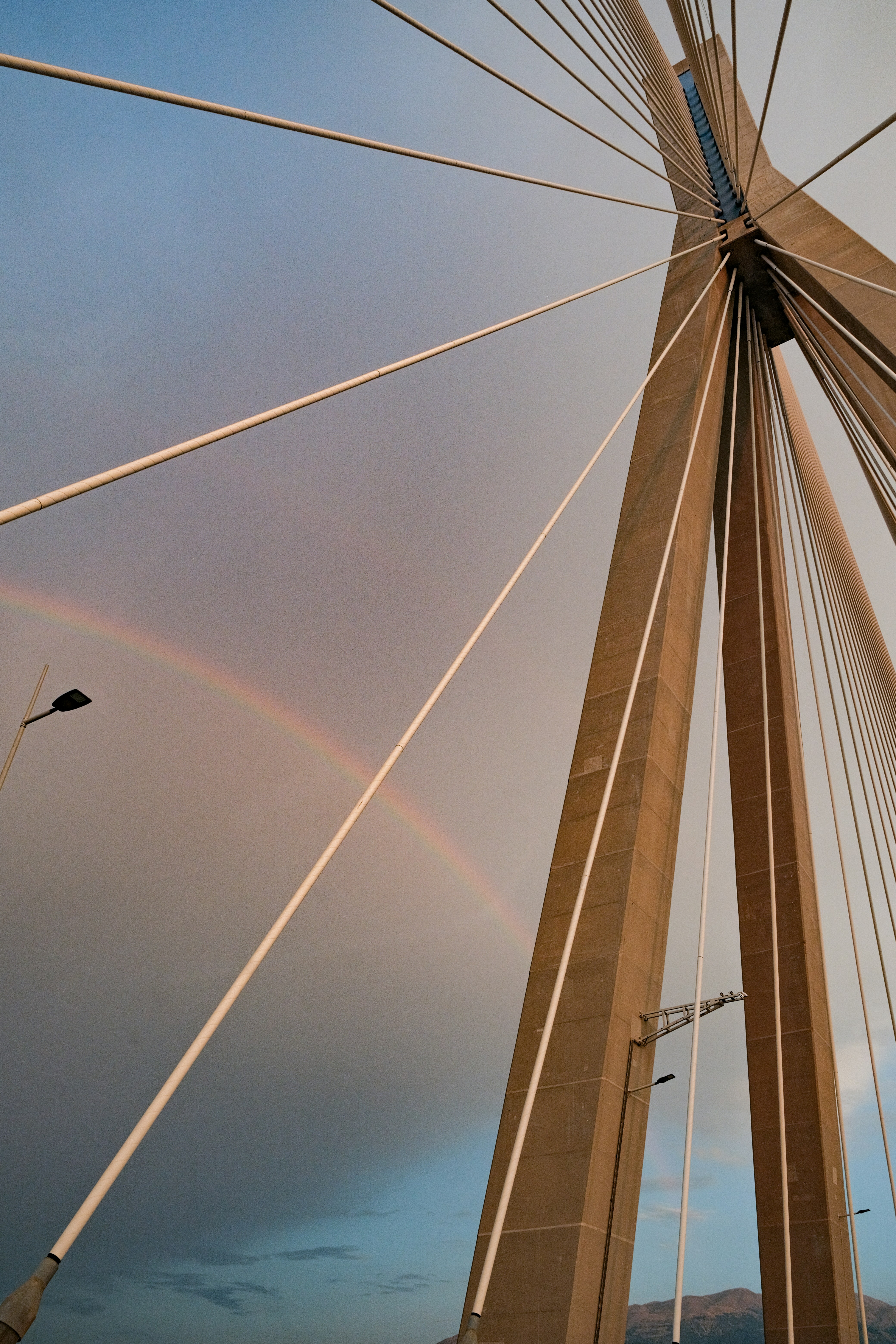 Confluence of Lines and Light: Rainbow Above a Cable-Stayed Tower
