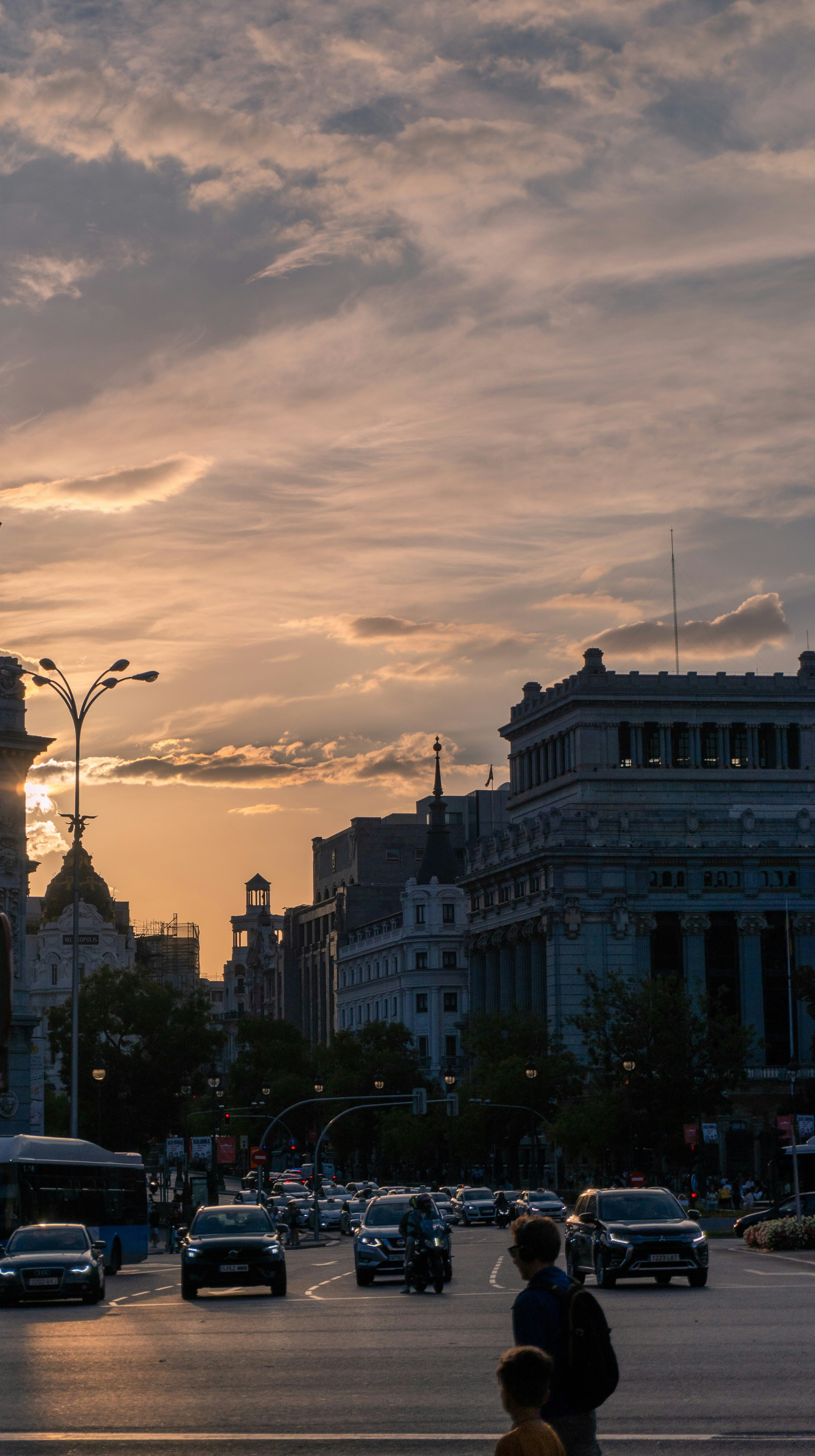 Golden Hour Boulevard: Sunset Over a Bustling City Street