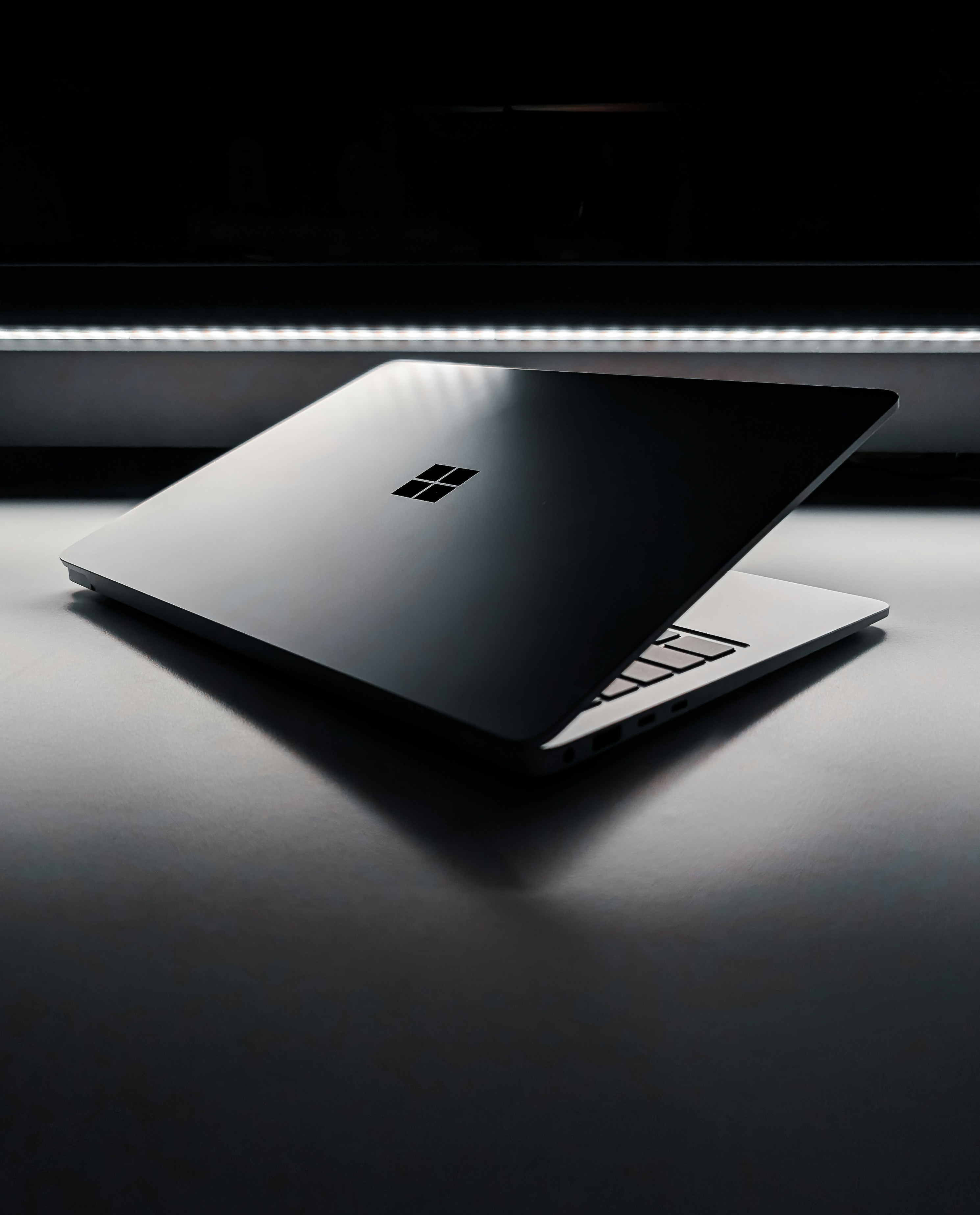 A laptop computer sitting on top of a table photo – Free Computer Image ...