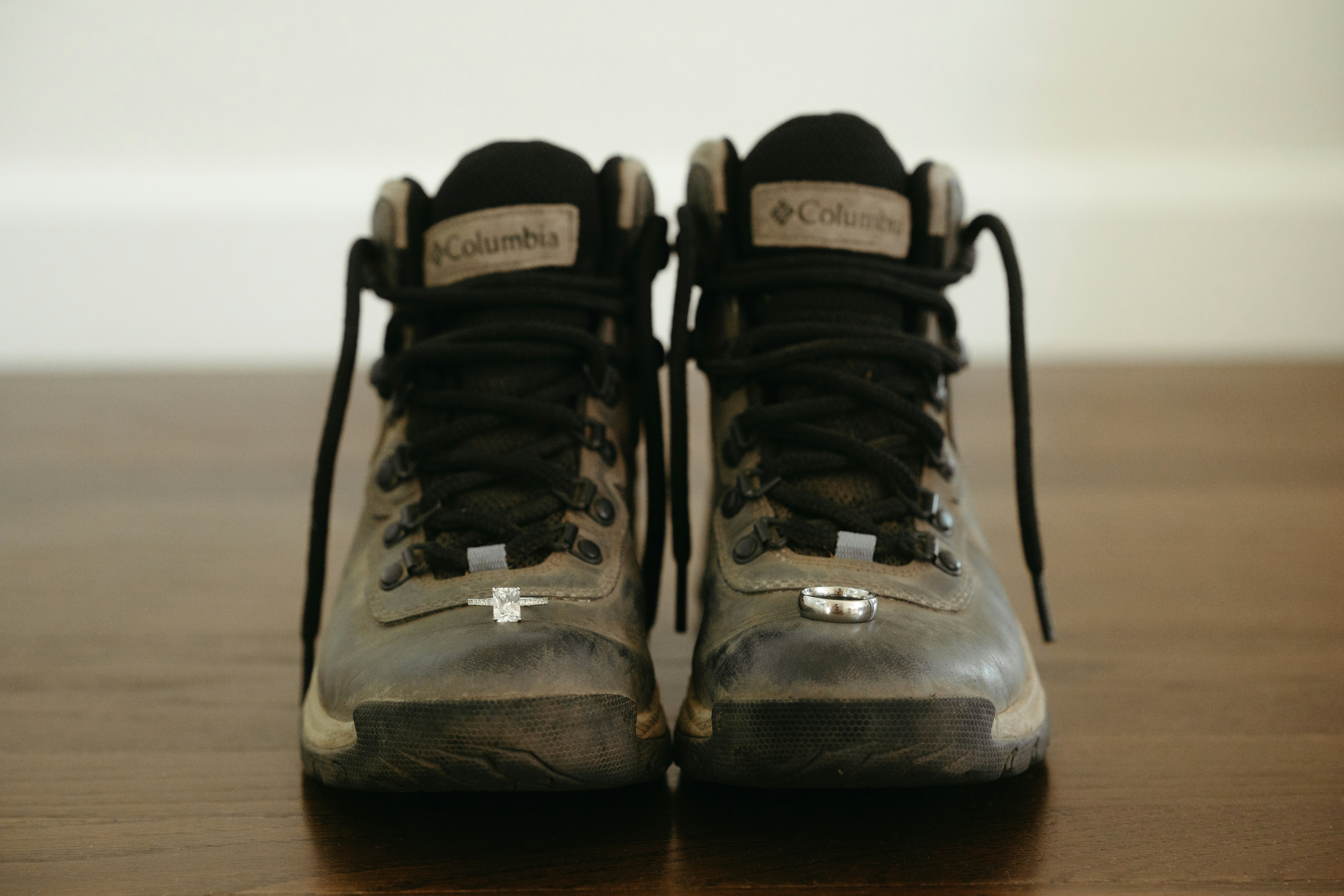 Centered Columbia Hiking Boots on a Quiet Hardwood Floor