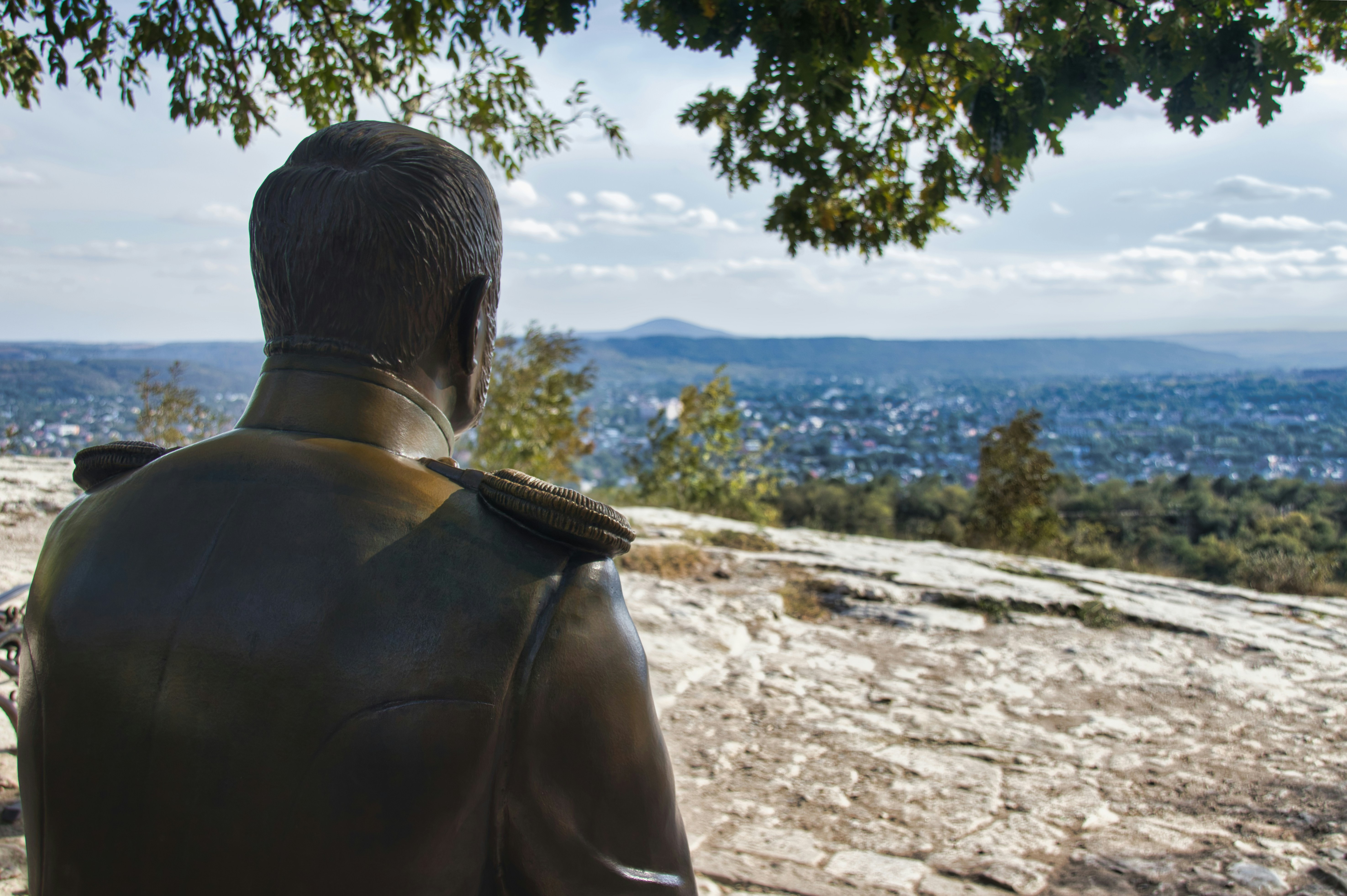 Reflections from the Summit: A Bronze Sentinel