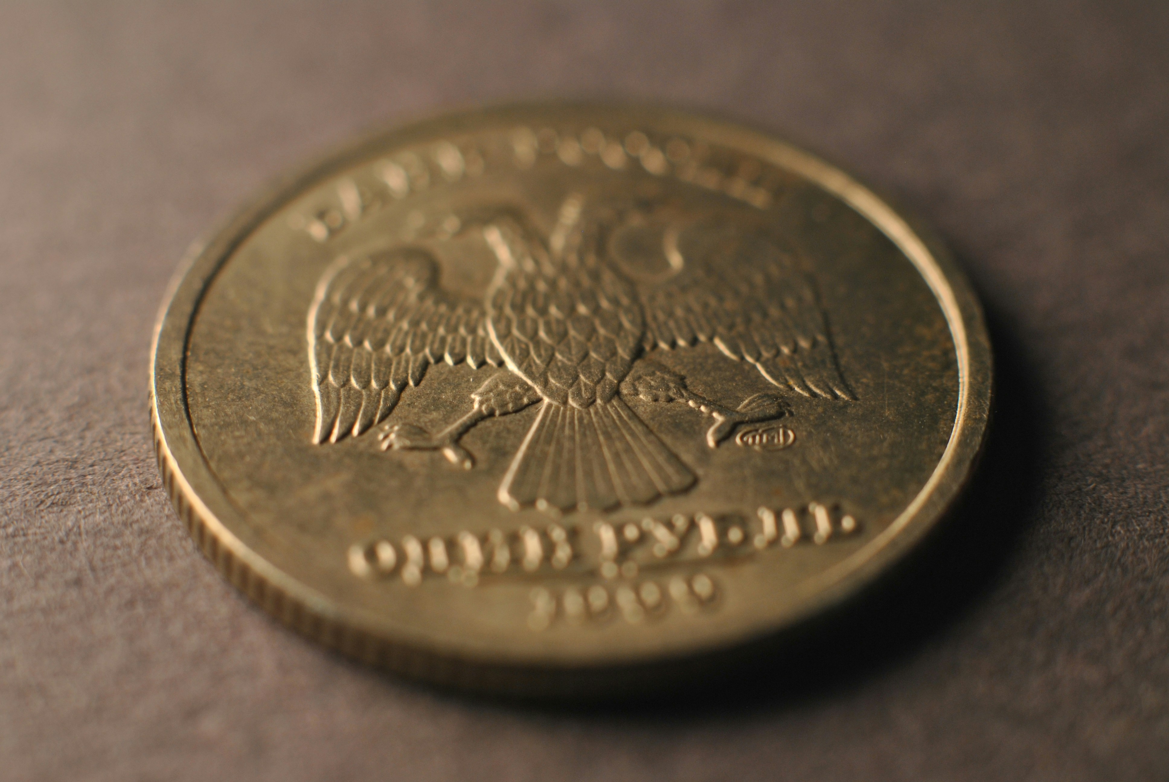 A close up of a coin on a table photo – Free Money Image on Unsplash