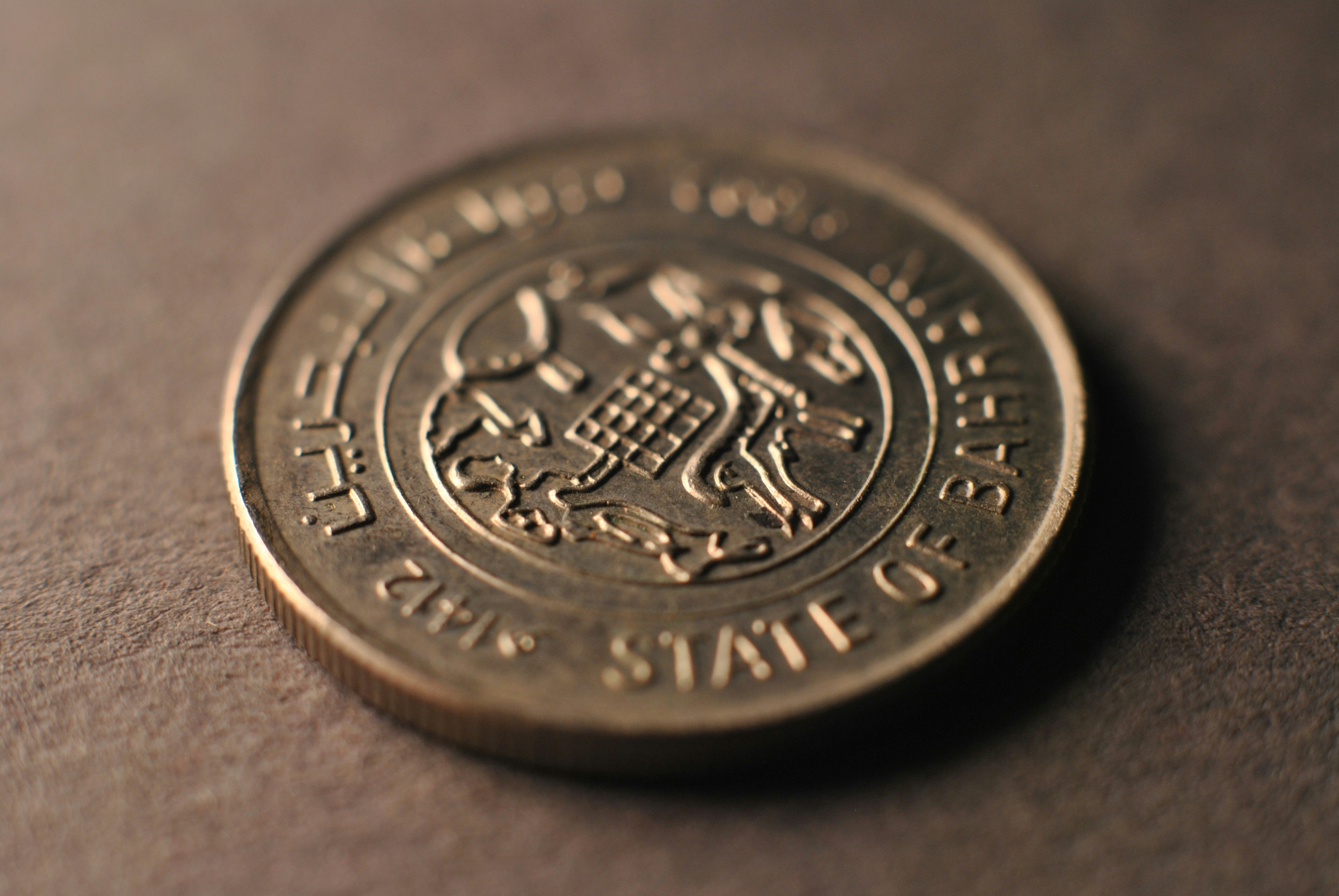 Close-Up of a Nickel: Subtle Texture and Inscribed Emblem