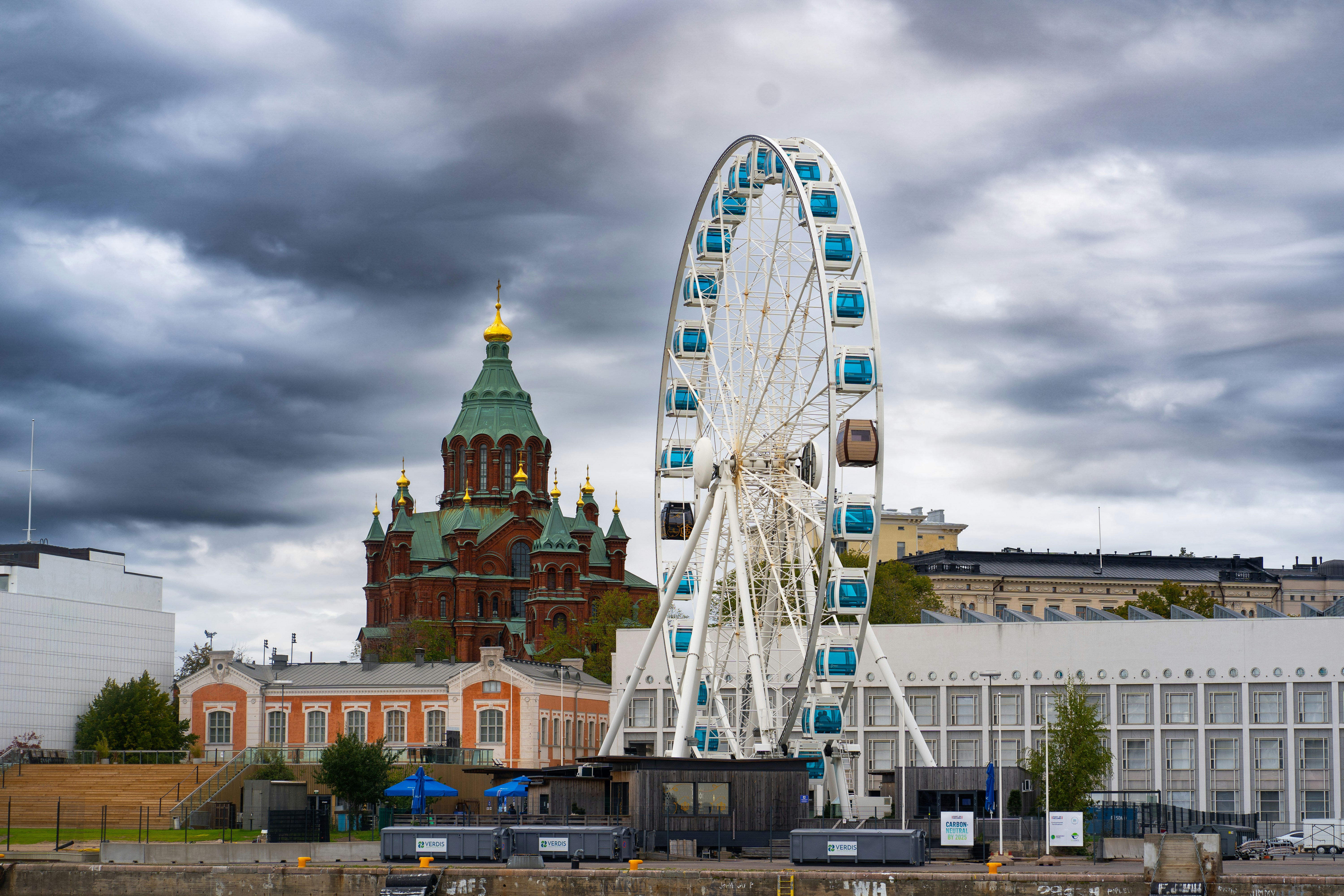 A ferris wheel in front of a large building photo – Free Helsinki Image ...