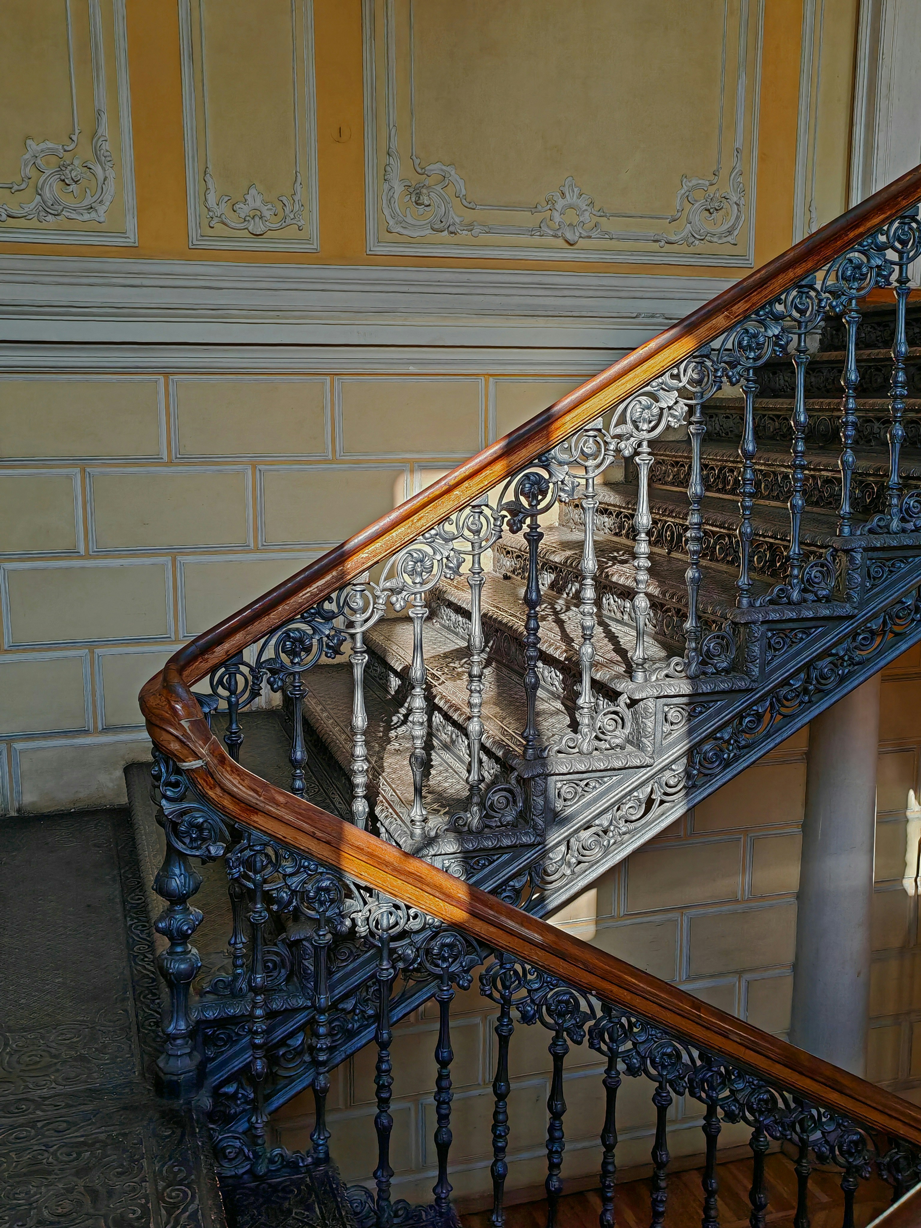 A stair case in a building with a clock on it photo – Free Russia Image ...