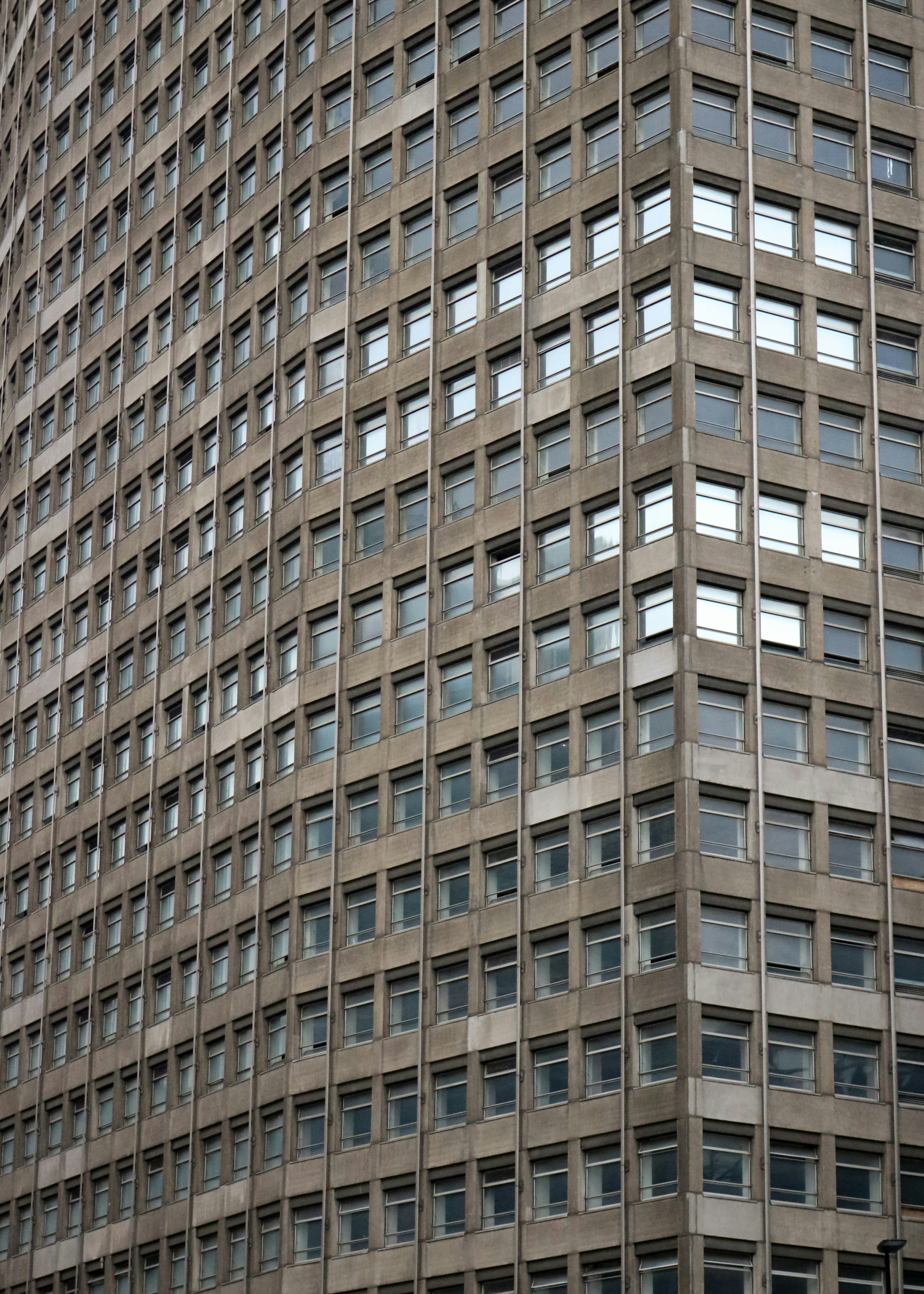 Abandoned (presently demolished) huge office building in Victoria London, a lot of windows.
