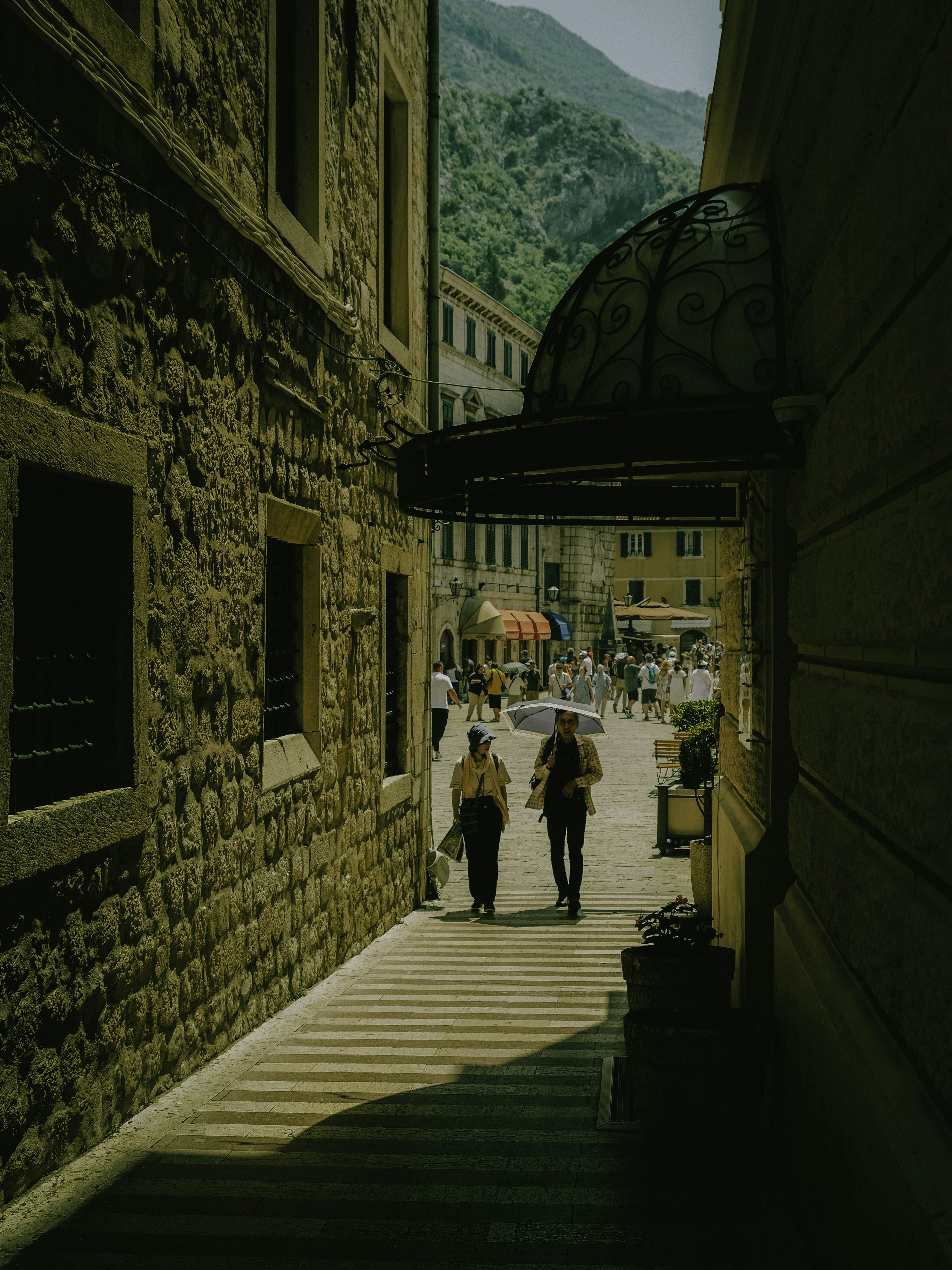 Light at the End of a Stone Alley: A Quiet Piazza Emerges