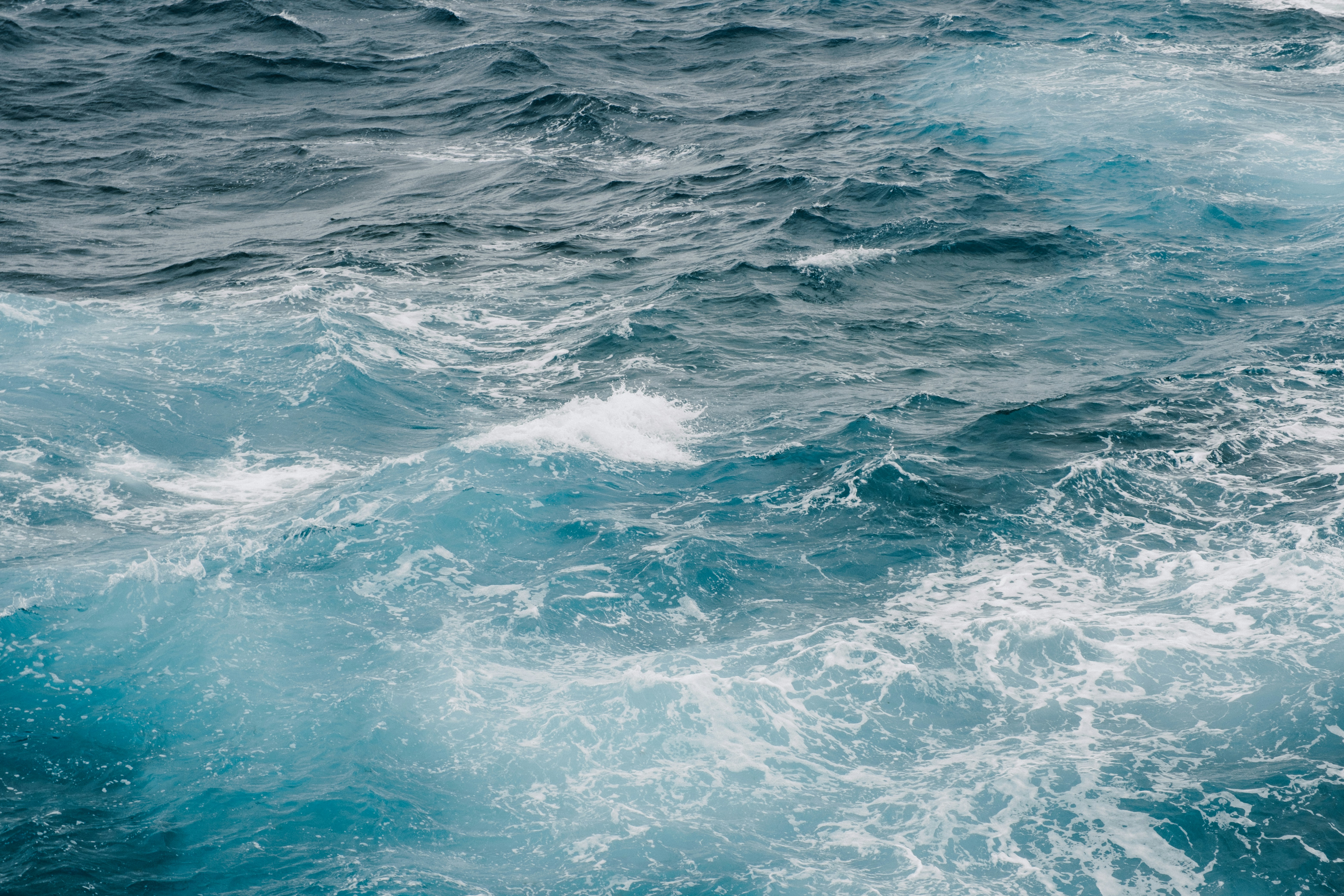 A large body of water with lots of waves photo – Free Sea Image on Unsplash