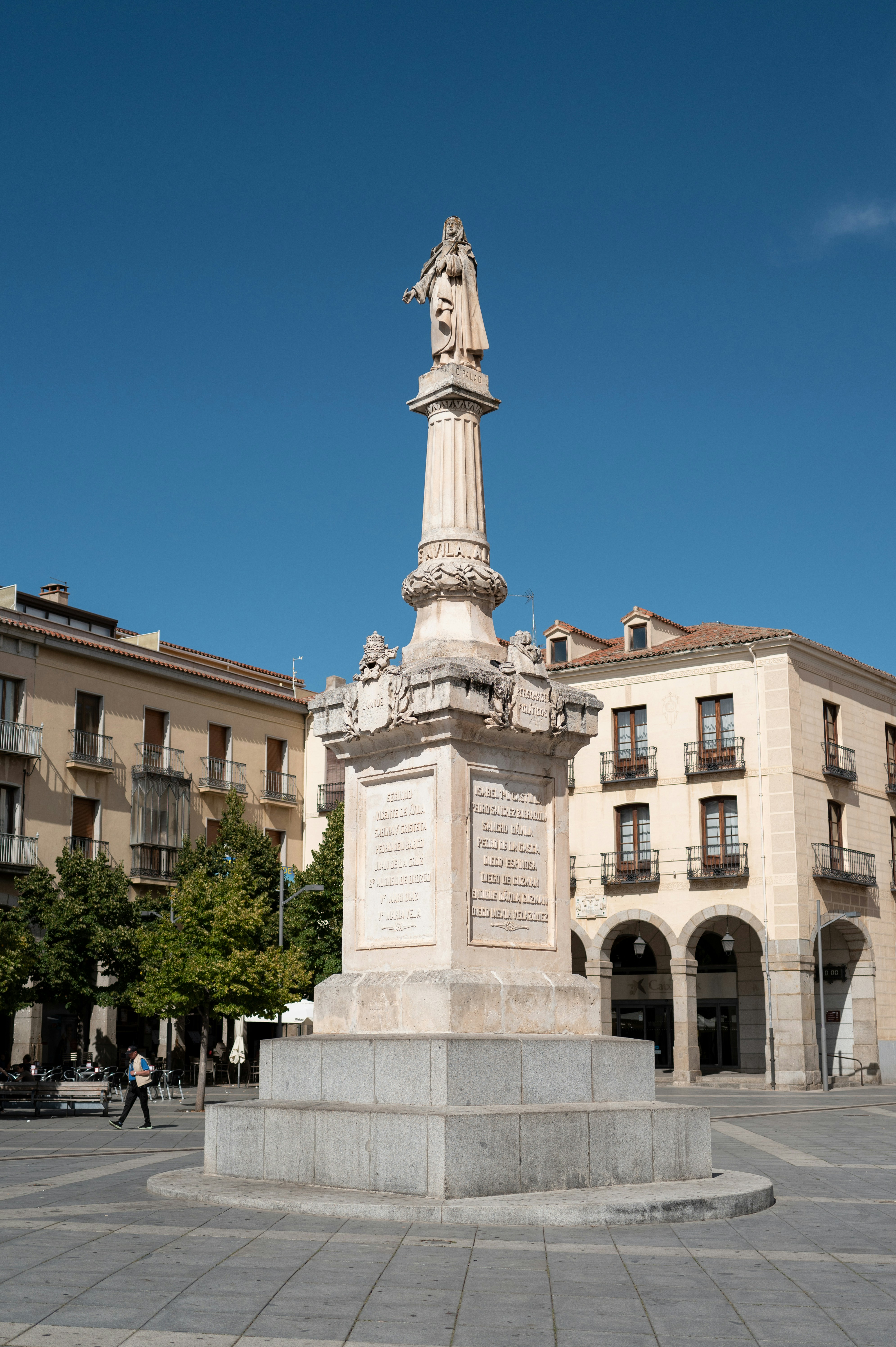 Marble Sentinel Under a Clear Blue Sky in a European Square