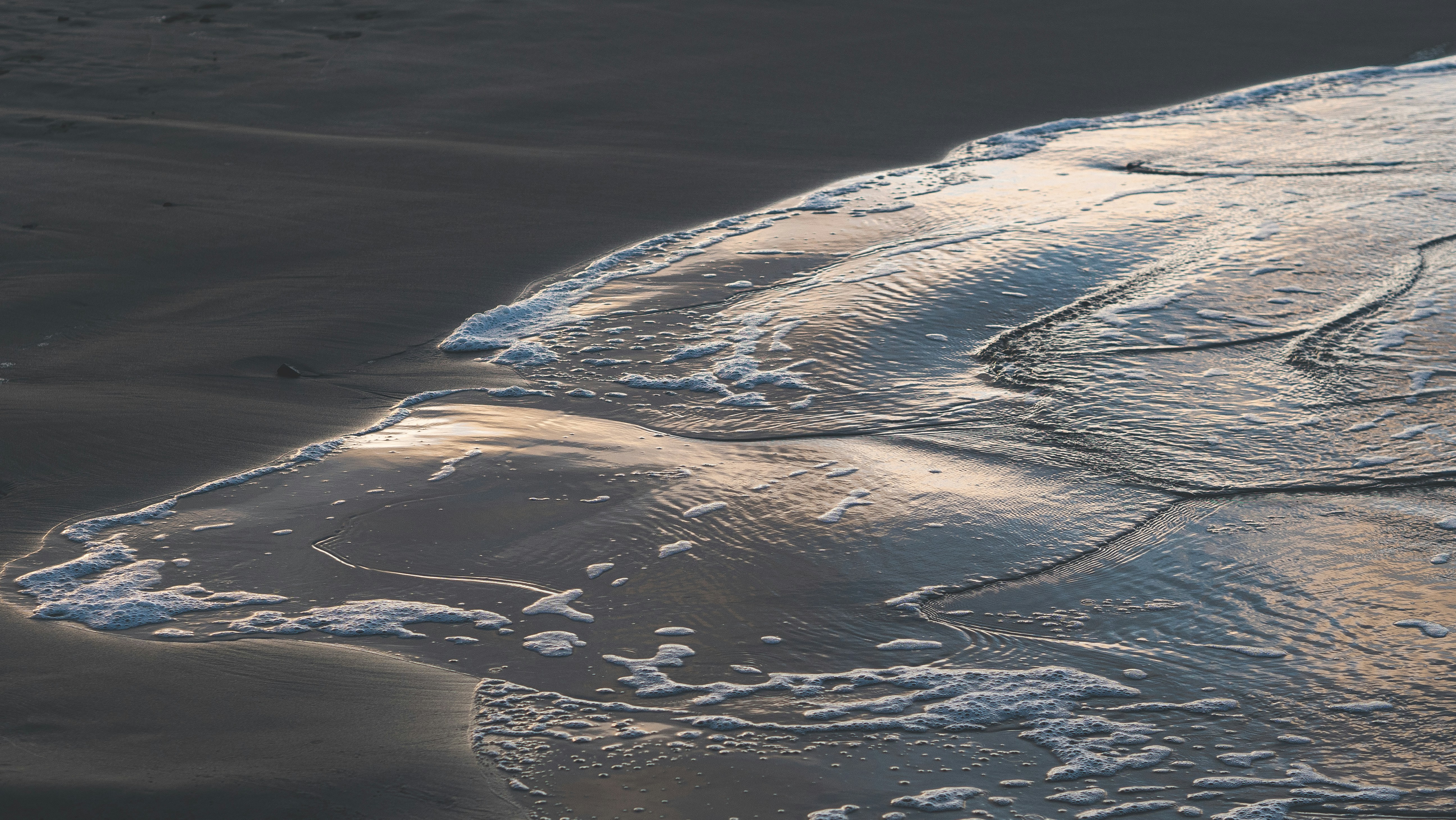 Moonlit Ice Ribbons Along a Quiet Shore