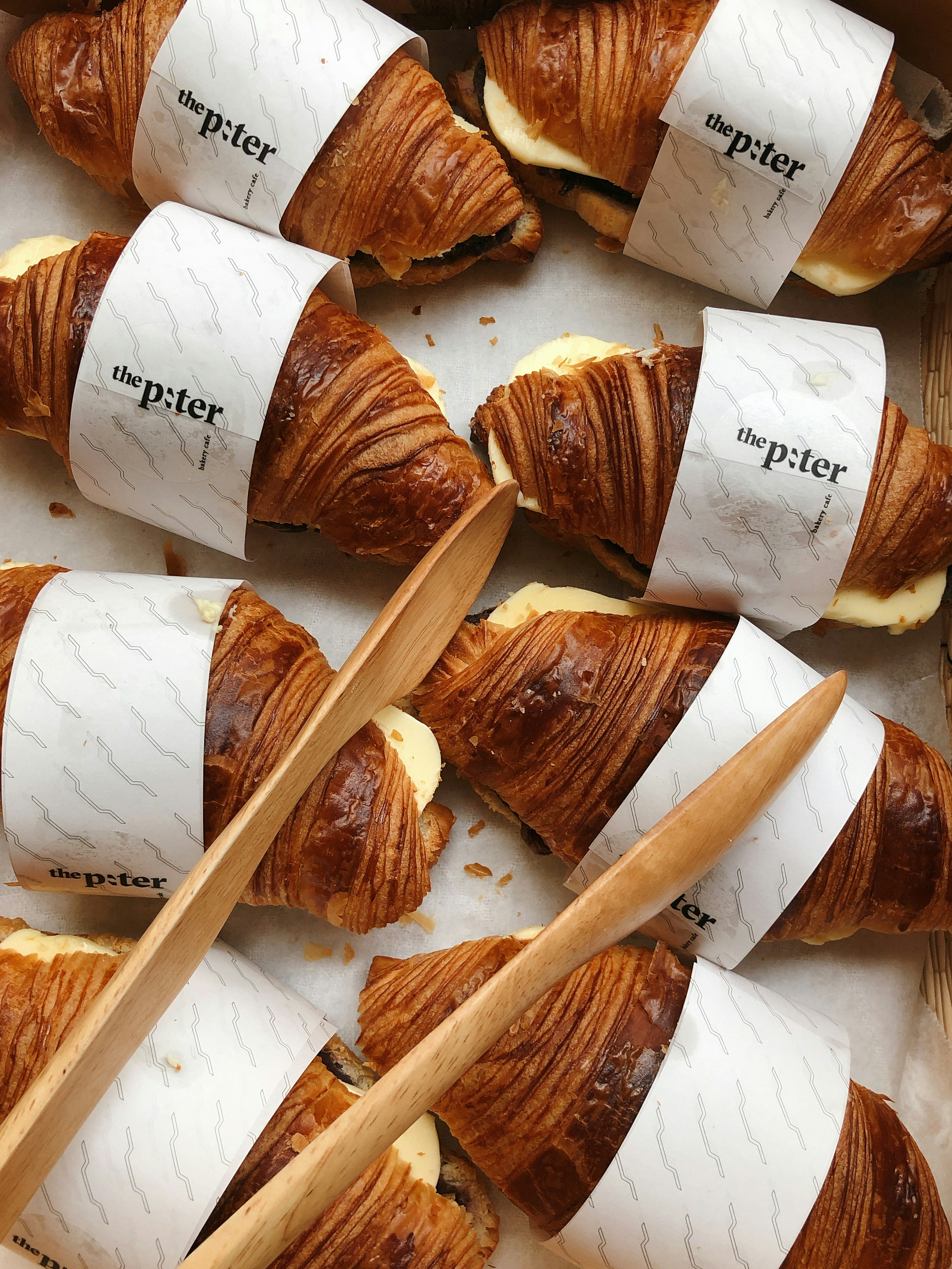 A box filled with croissants wrapped in paper photo – Free Wallpaper ...