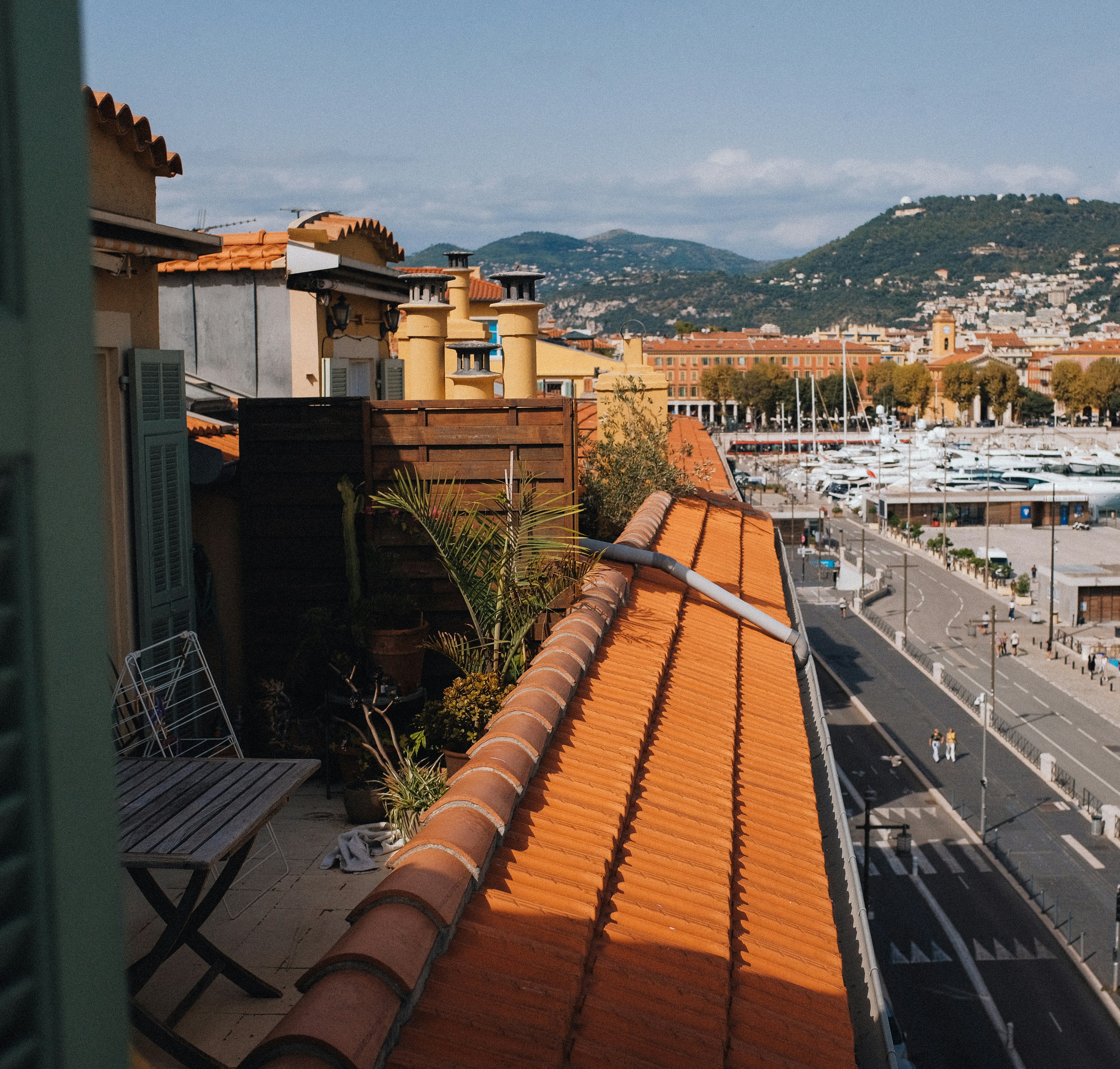 Terracotta Ridge: A Rooftop Perspective Over a Marina Cityscape