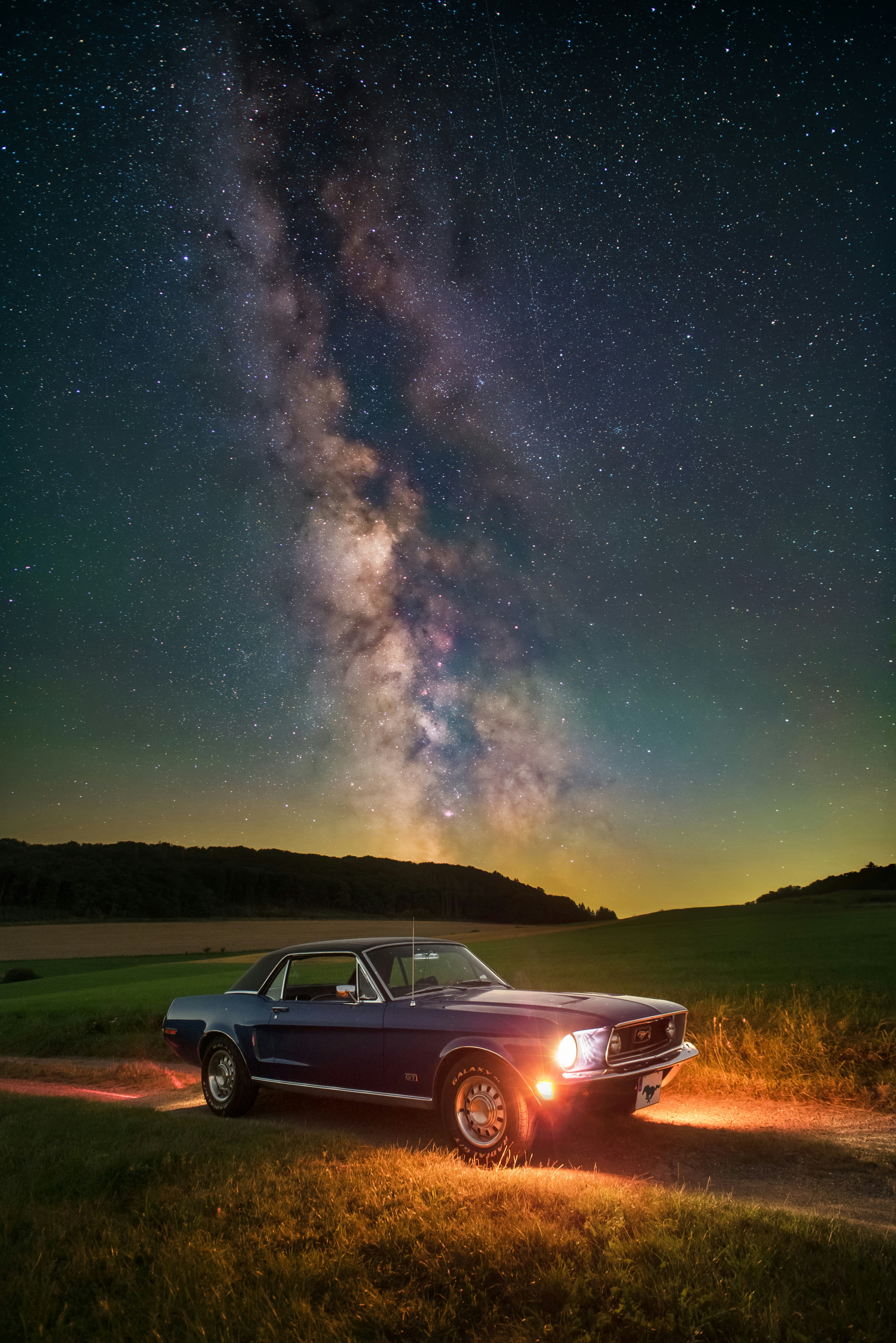 Milky Way Over a Vintage Blue Mustang on a Quiet Rural Road