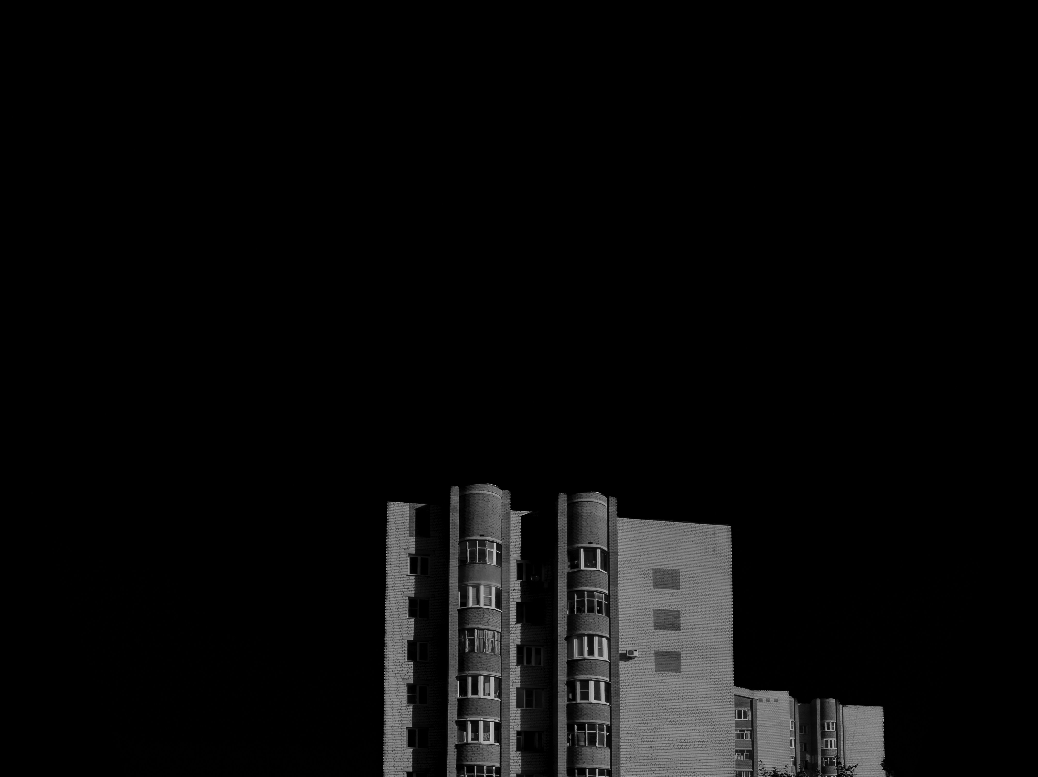 Midnight Monolith: A Silent City Tower Against the Black Sky