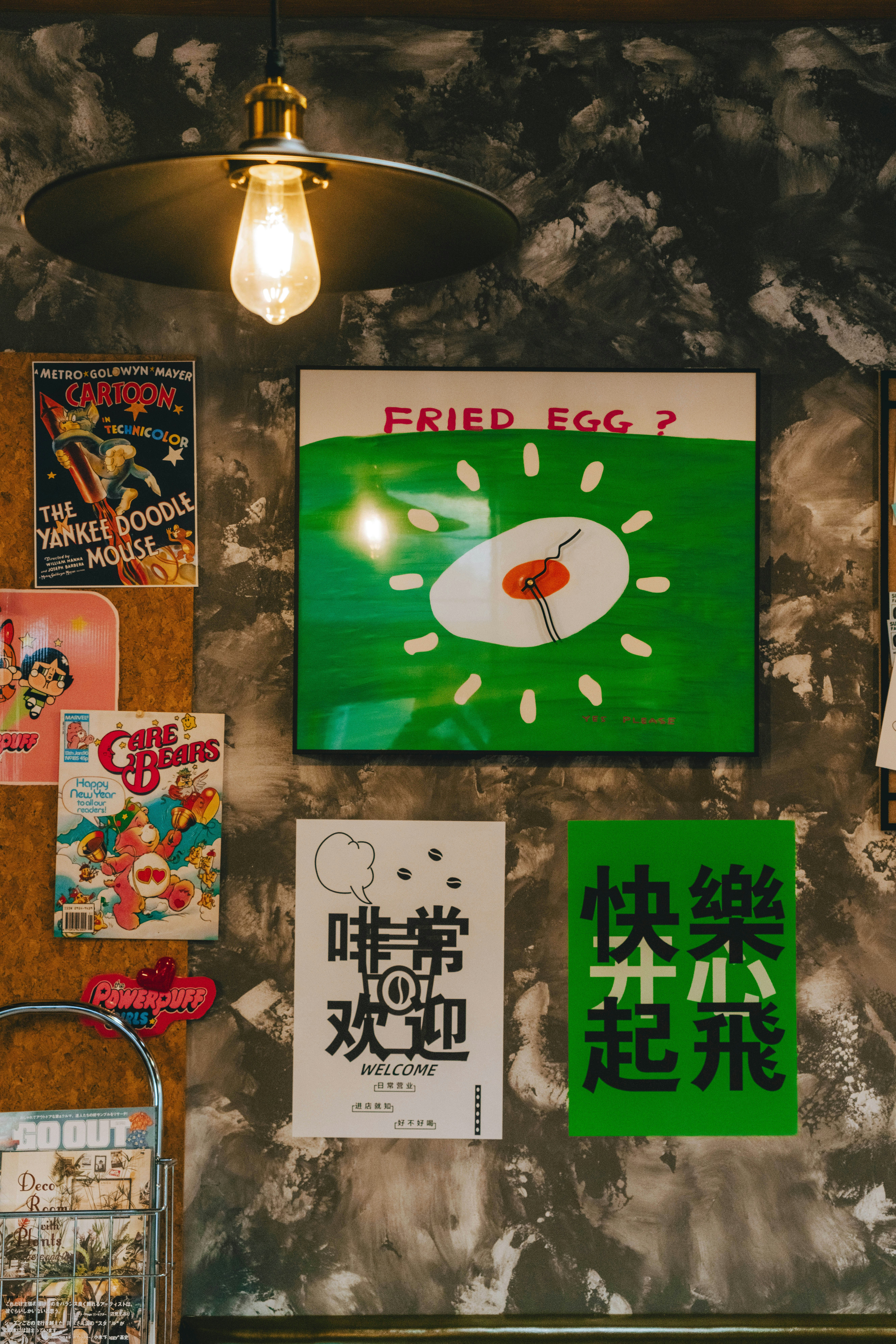 A wall covered in posters and a light bulb photo – Free Art Image on ...