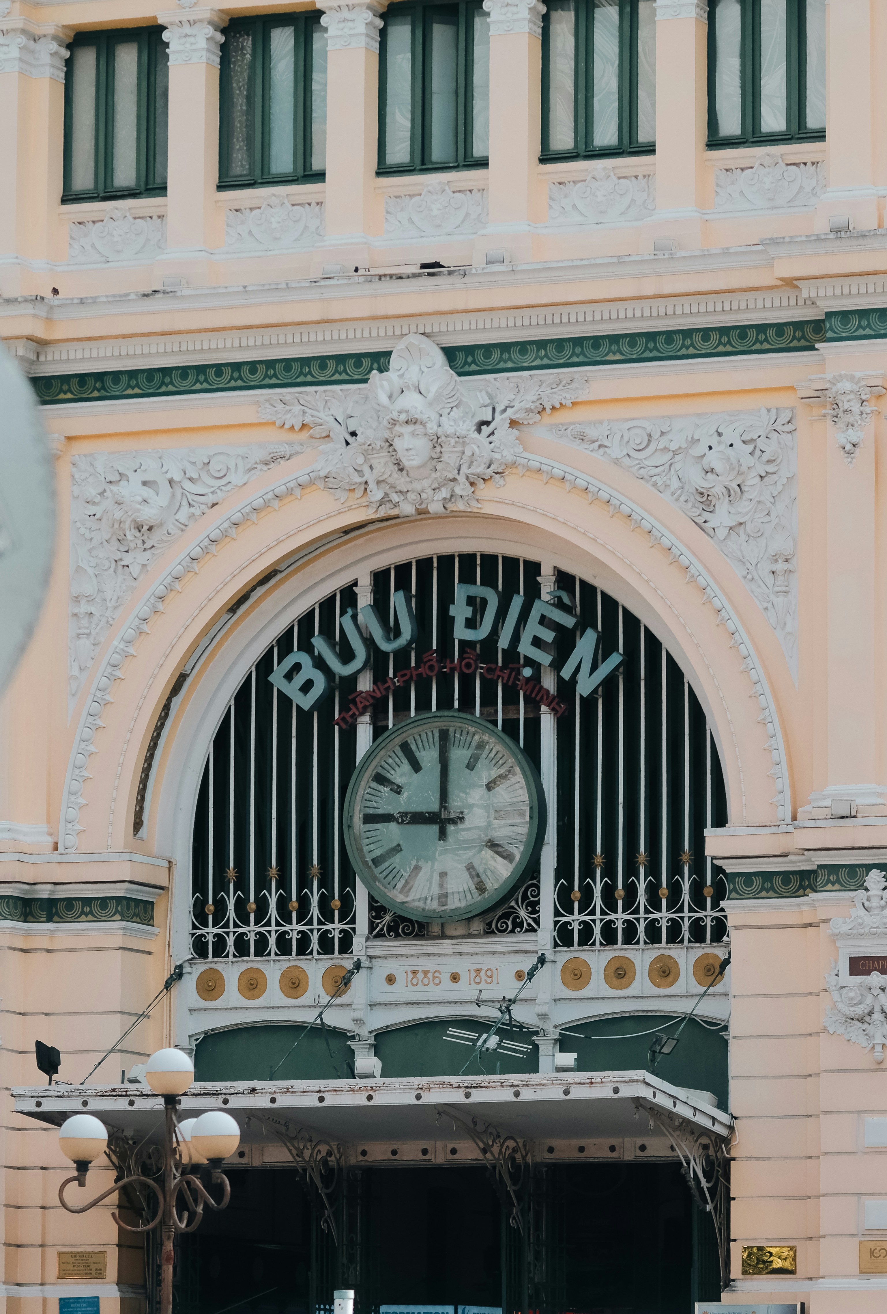A large building with a clock on the front of it photo – Free Building ...