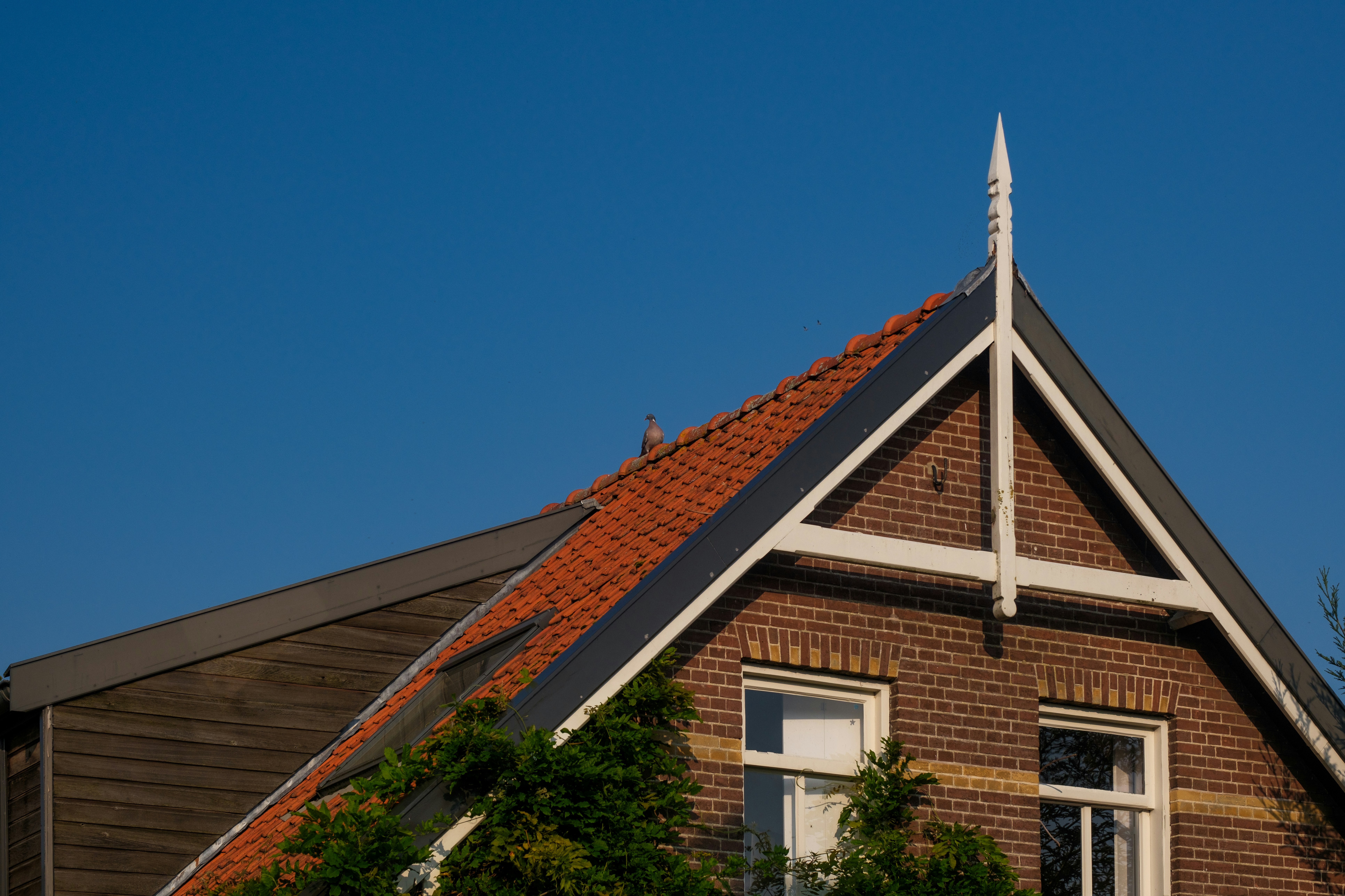 Apex of Brick Gable Beneath a Pristine Blue Sky