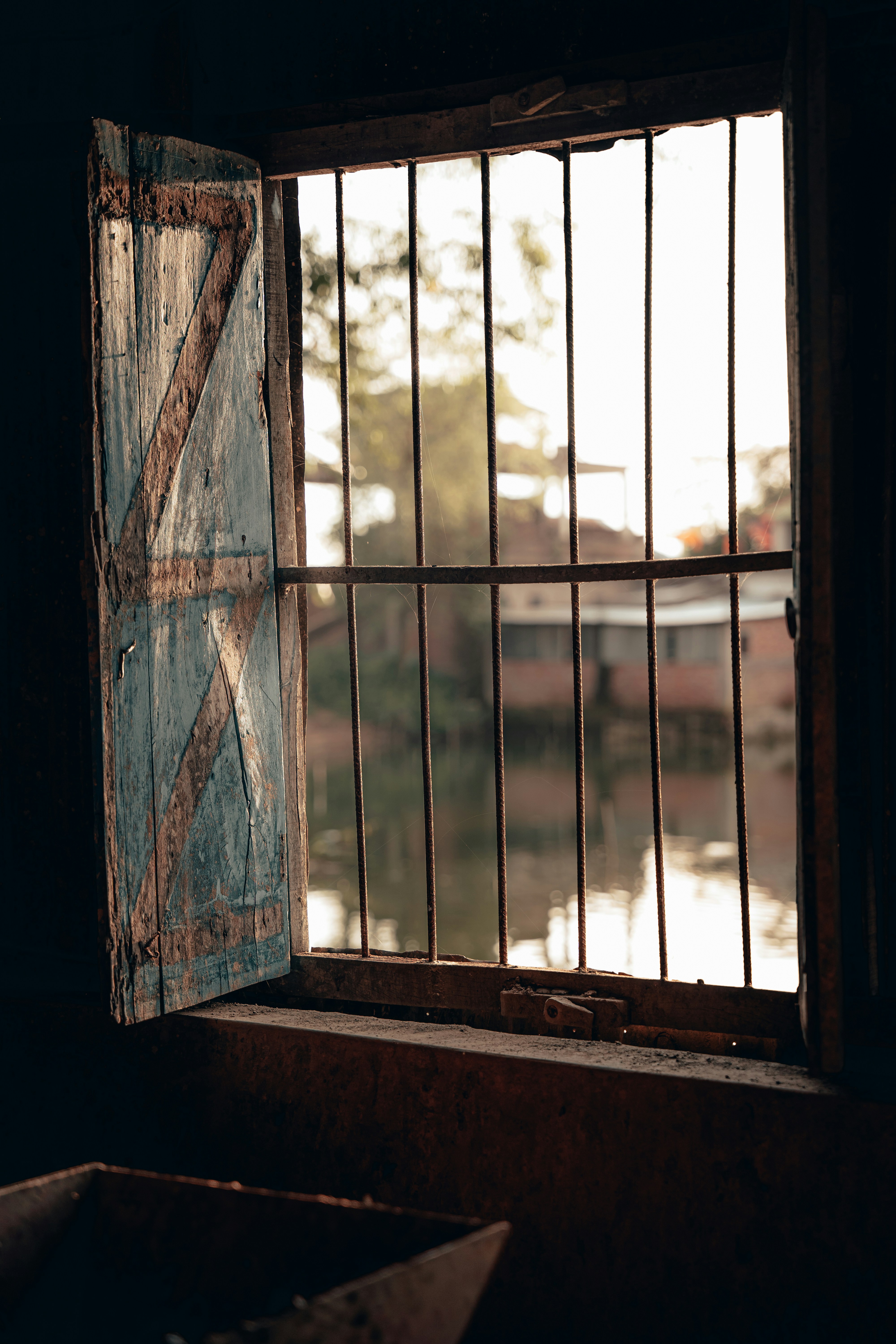 A window with bars and a flag painted on it photo – Free Comilla Image ...