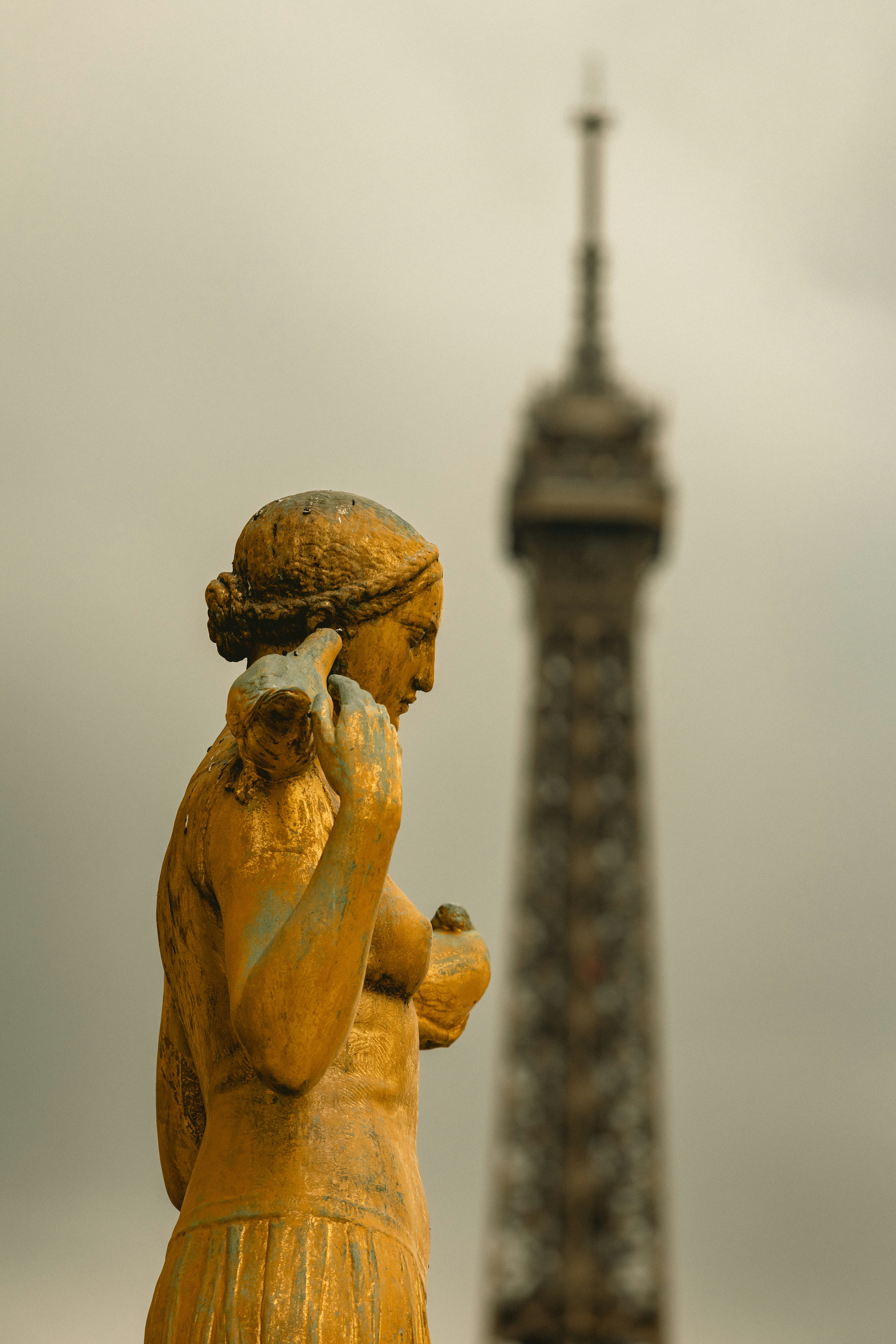 Bronze Portrait Against a Misty Spire