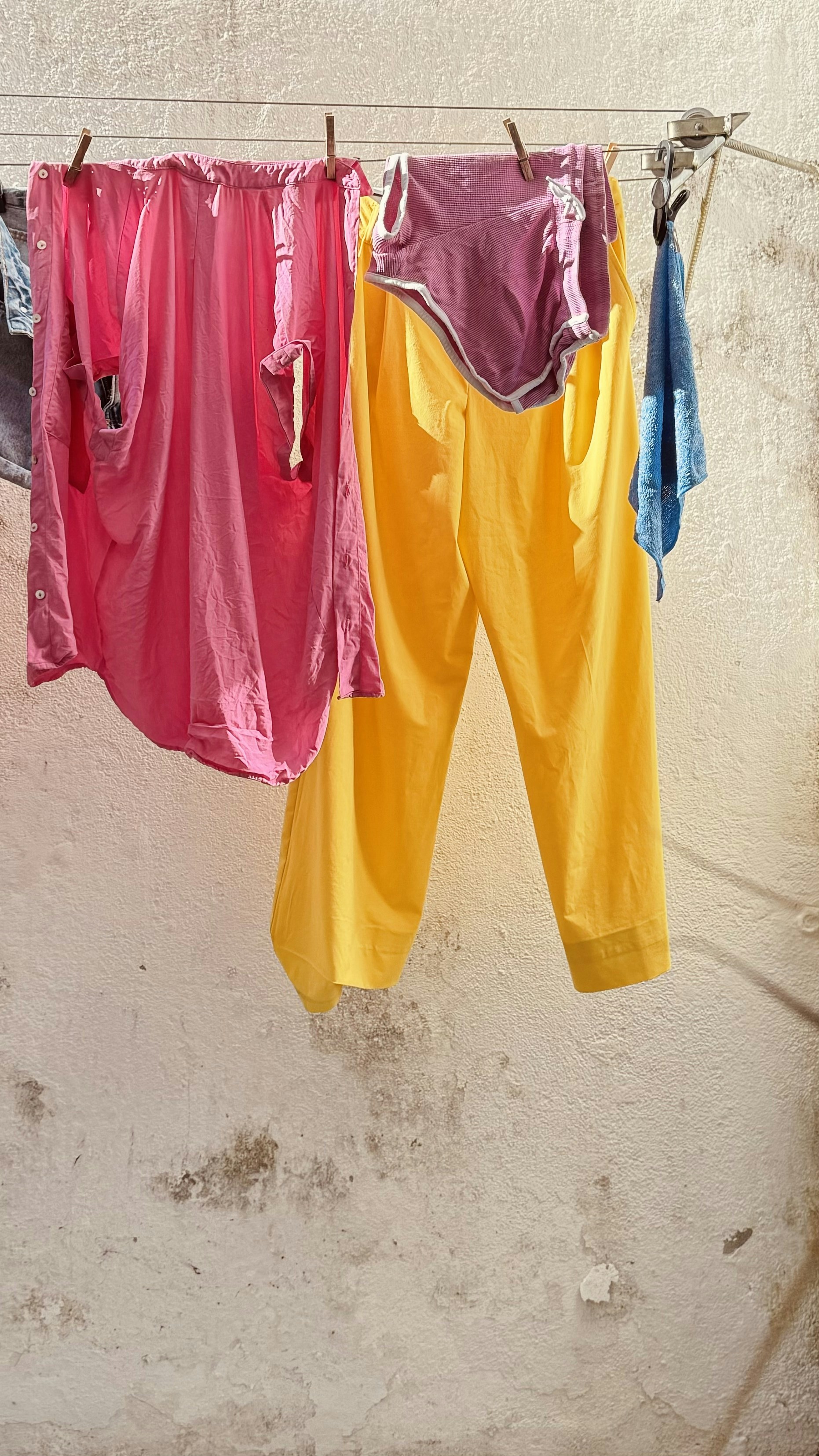 A line of clothes hanging on a clothes line photo – Free Skirt Image on ...
