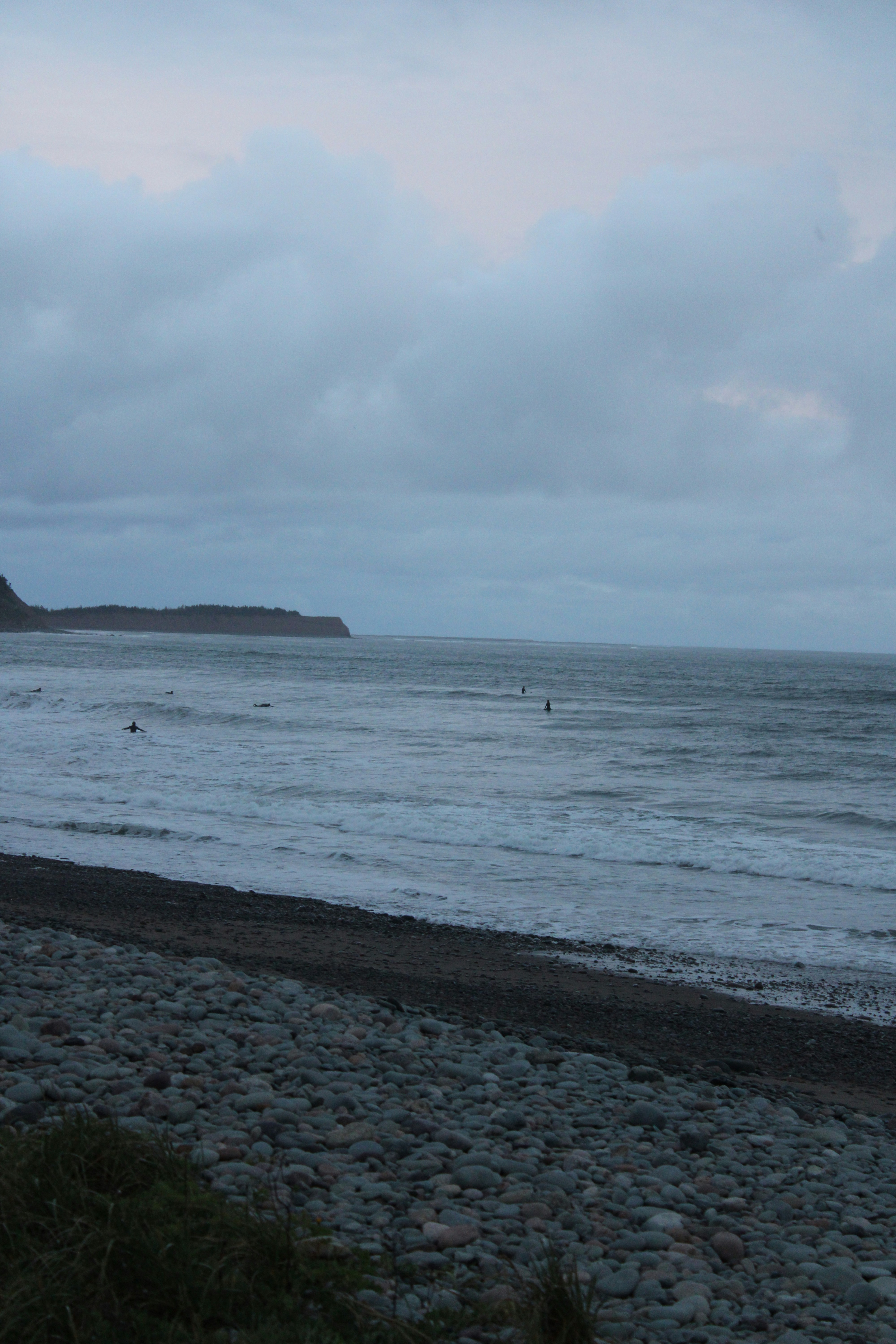 Cloud-Washed Pebble Beach: A Quiet Confluence of Sea and Sky
