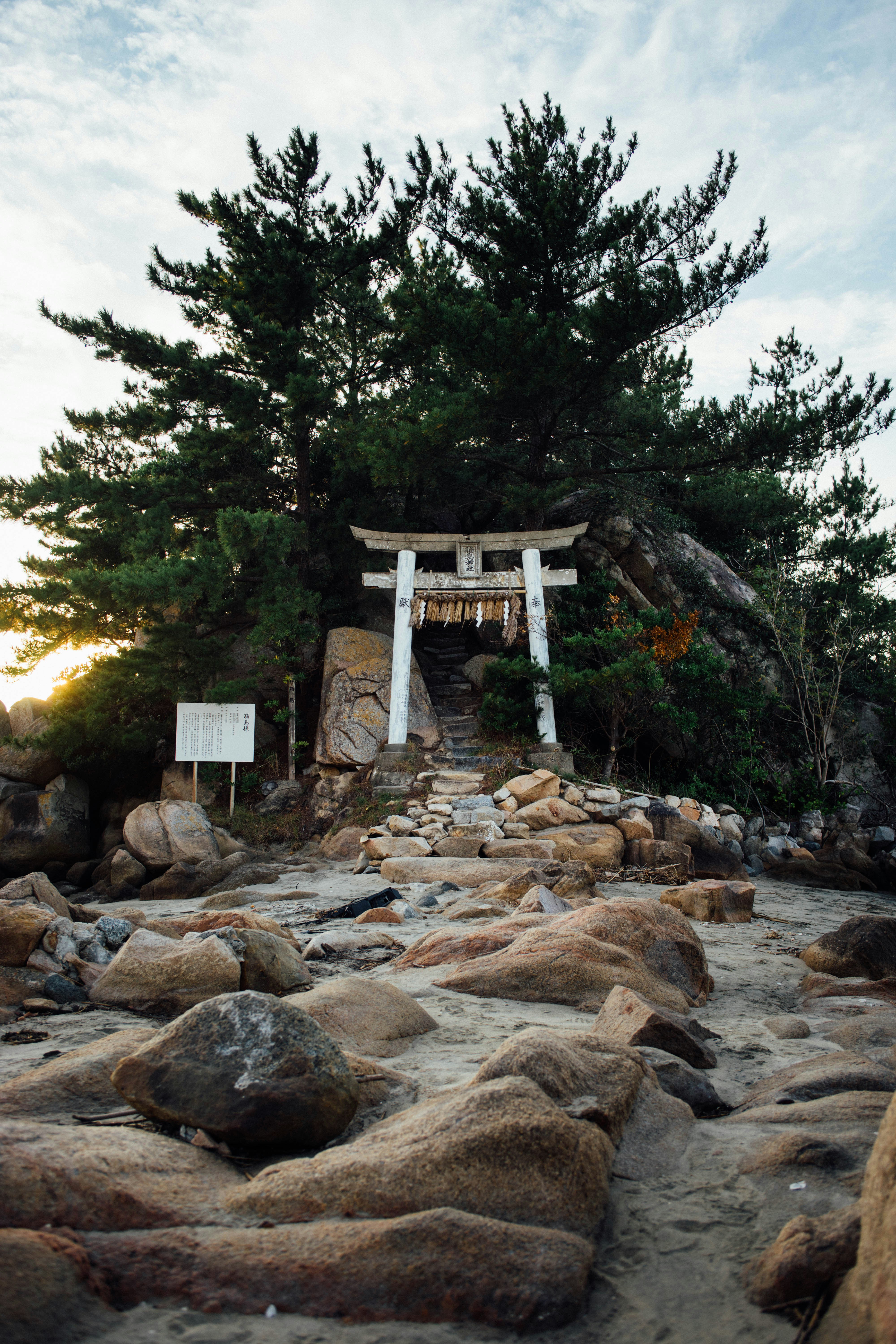 Torii on the Rock-Strewn Path: Quiet Ascent Through Pines