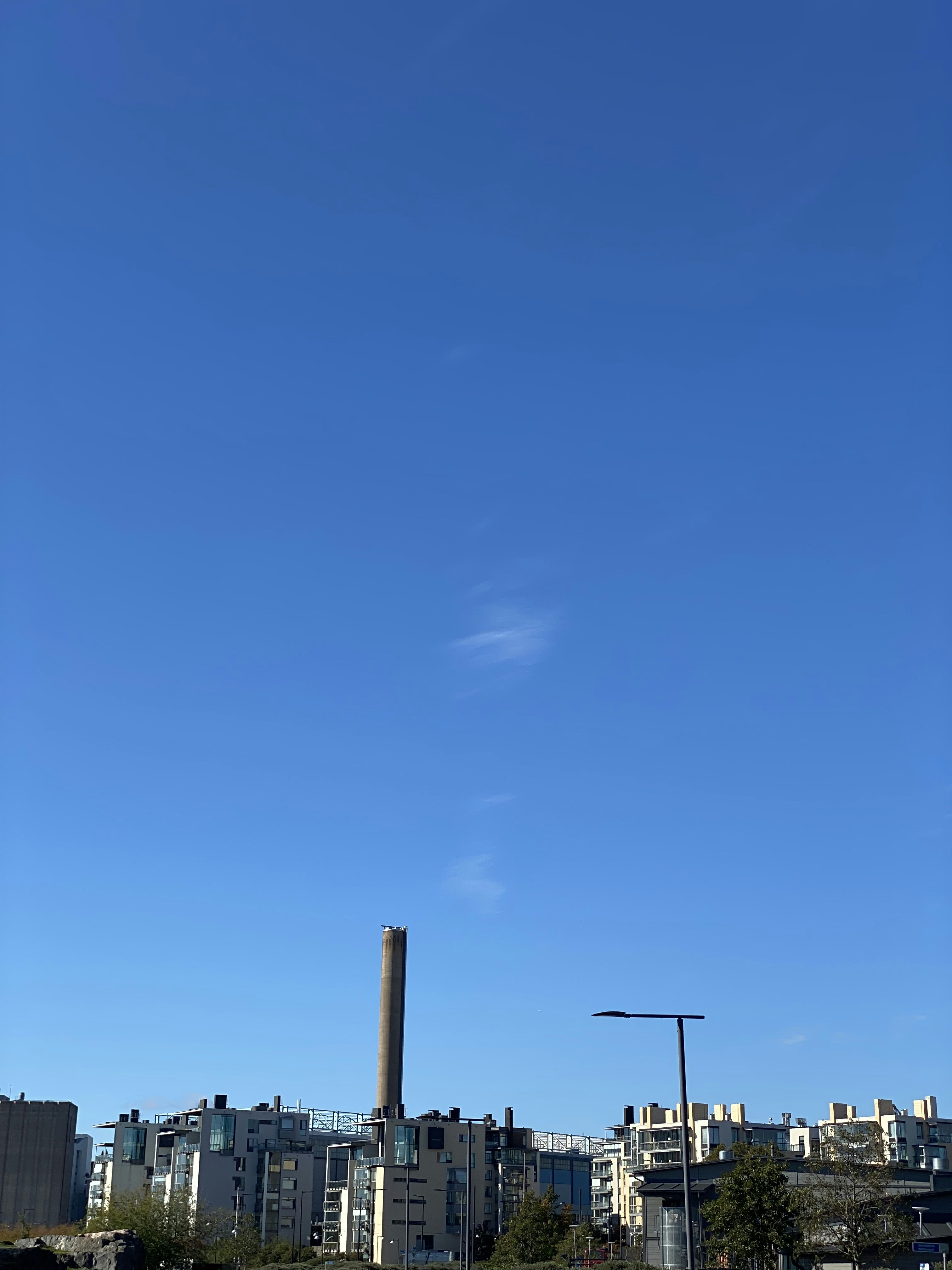 Chimney Obelisk Over a Quiet Urban Horizon