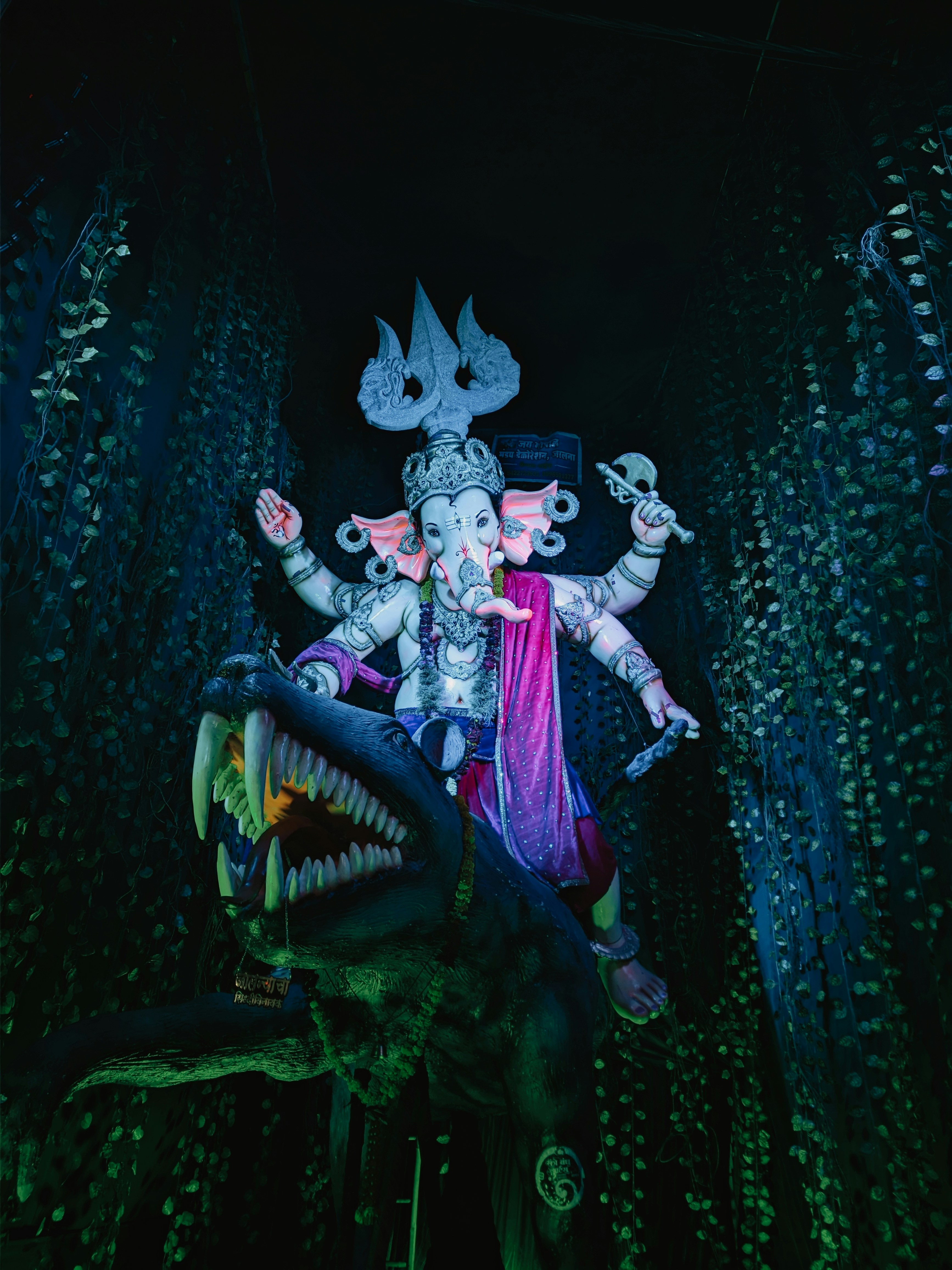 A statue of an elephant and a demon in a dark room photo – Free Jalna ...