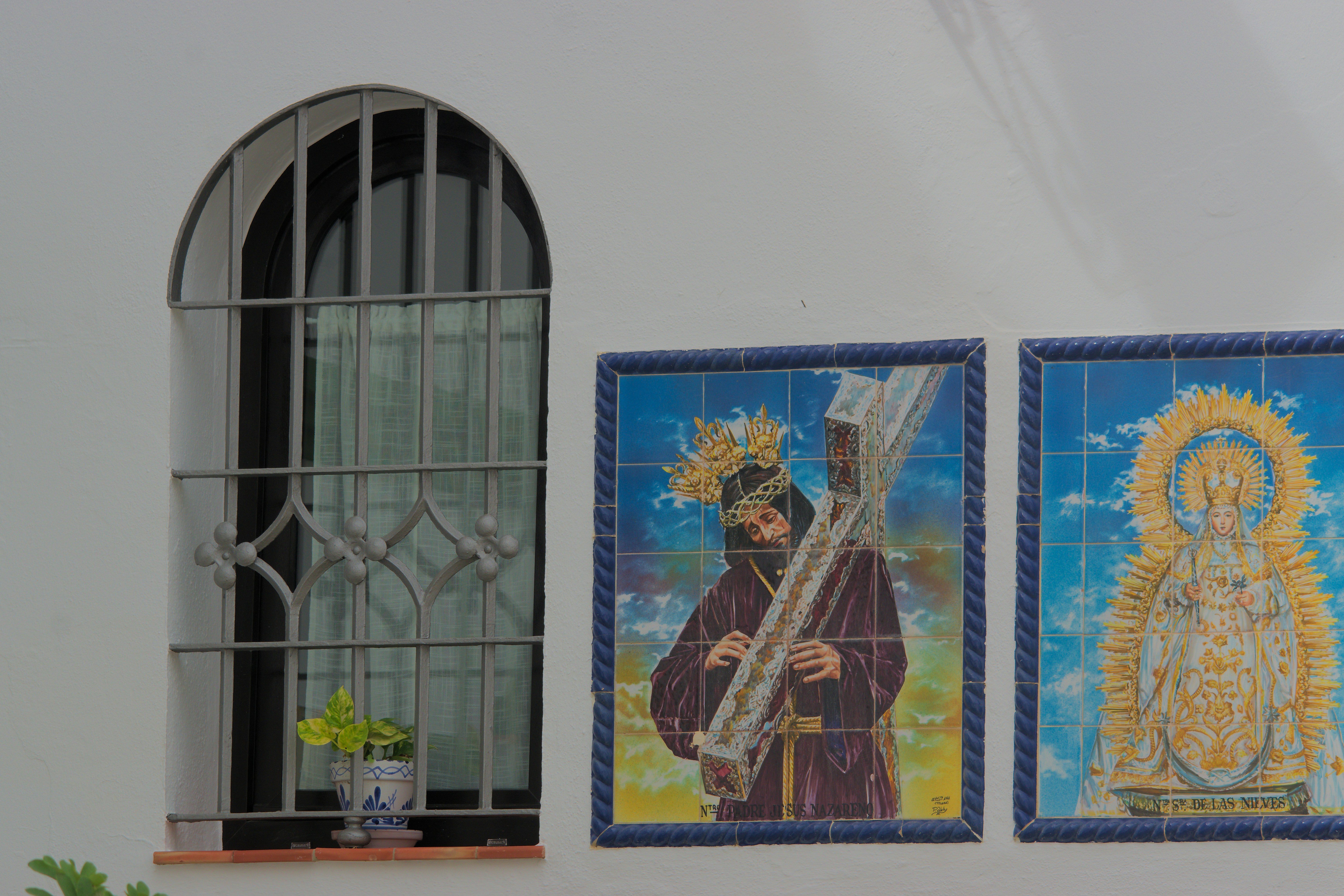 Religious Tiles and a Grilled Window