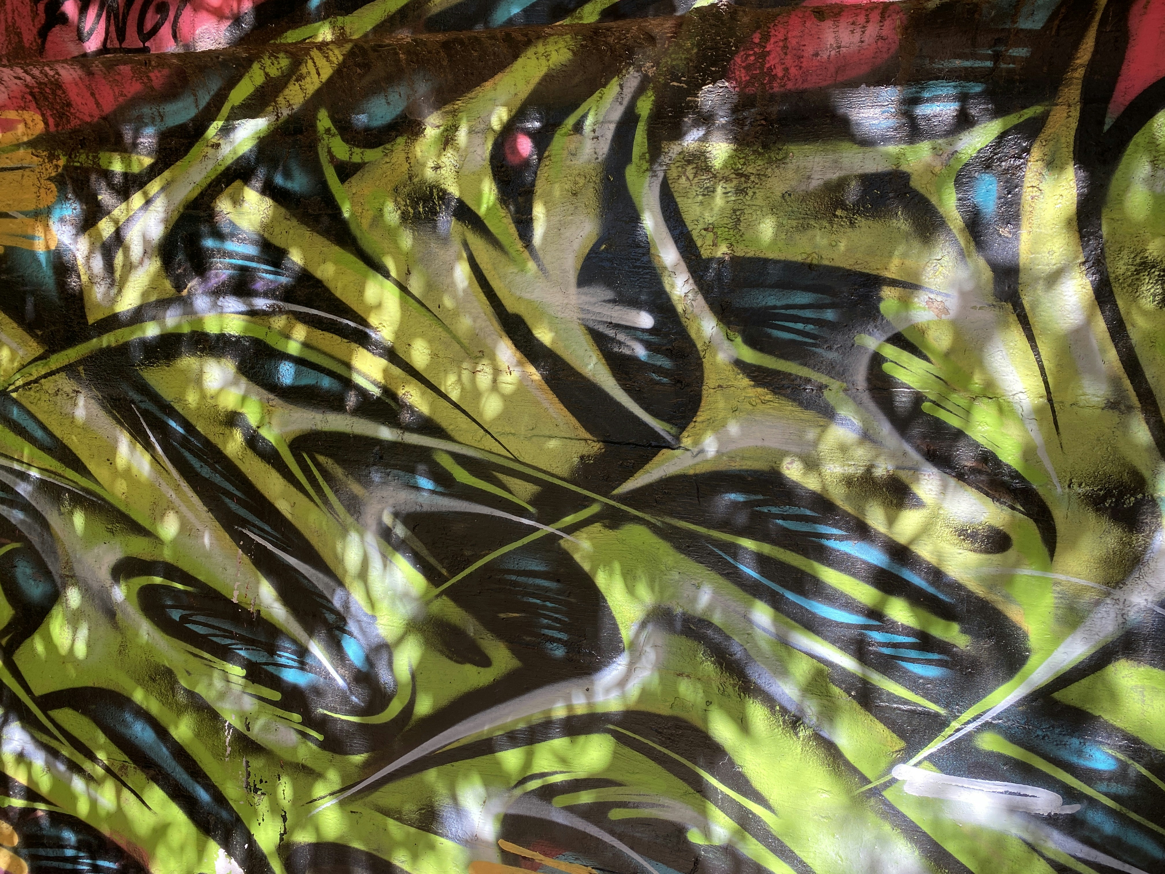 A wall with a bunch of graffiti on it photo – Free Los angeles county ...