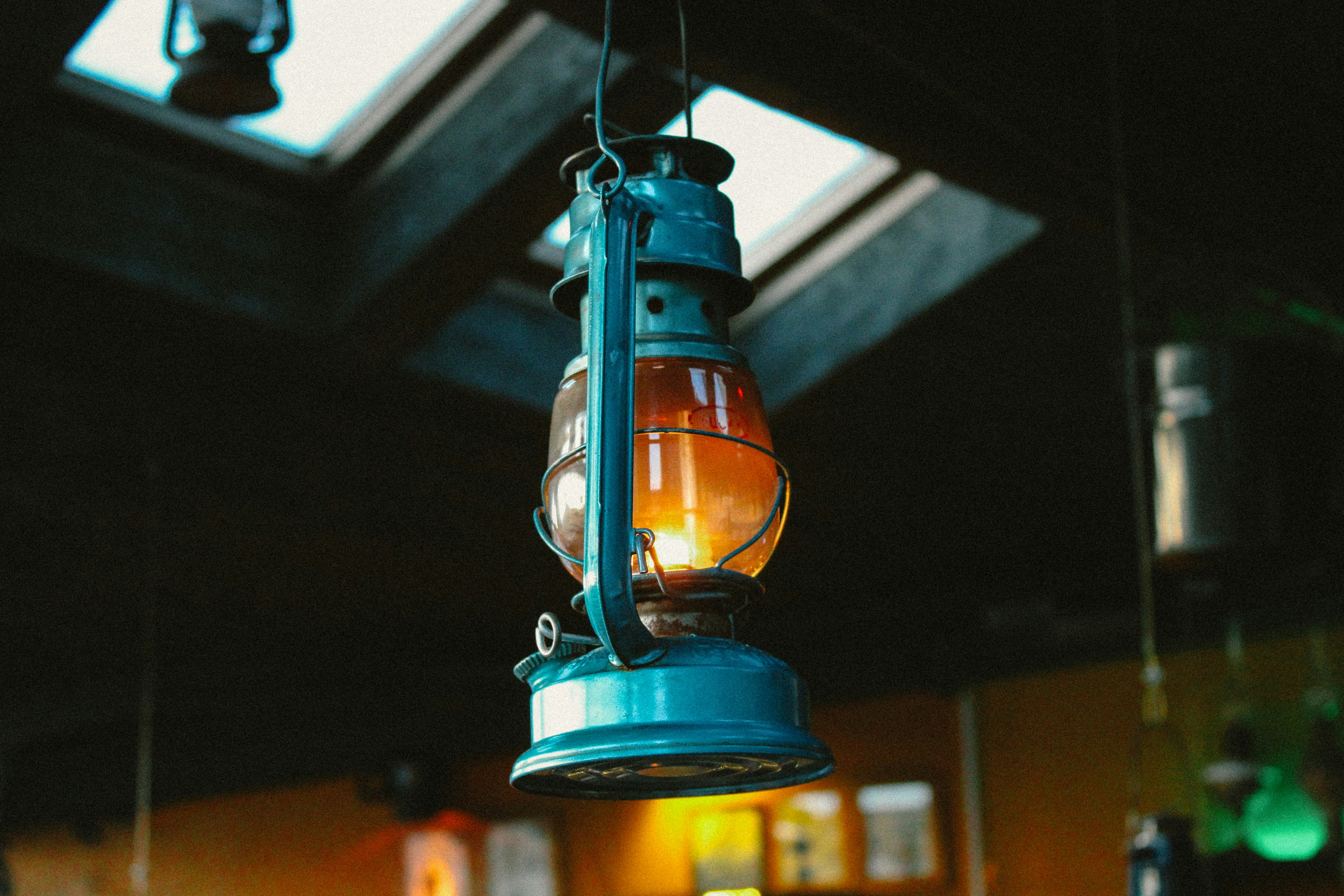 Azure Lantern: Warm Glow in a Dim Bar Interior
