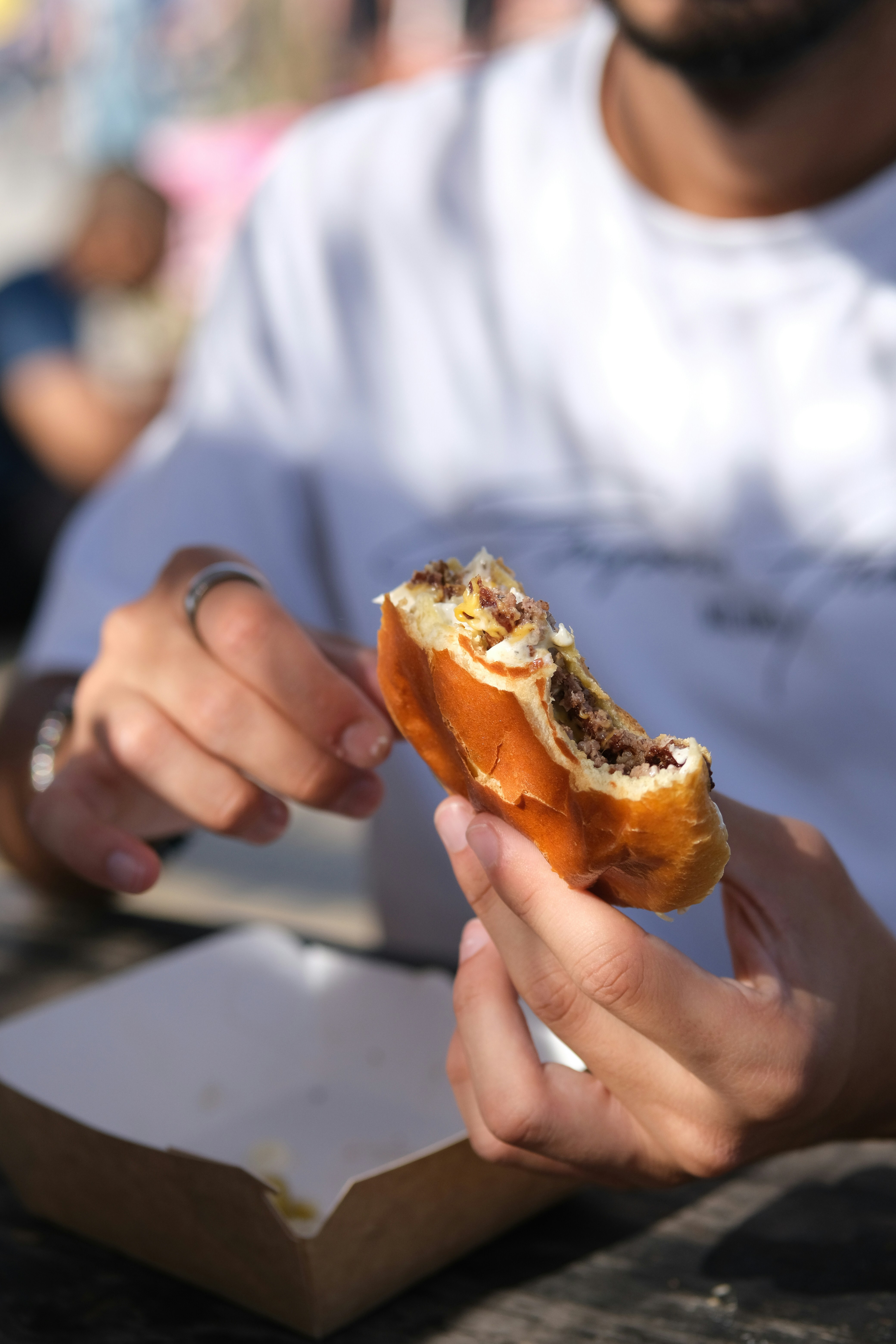 Afternoon Bite: Crumbs in Focus on a Sunlit Street Table