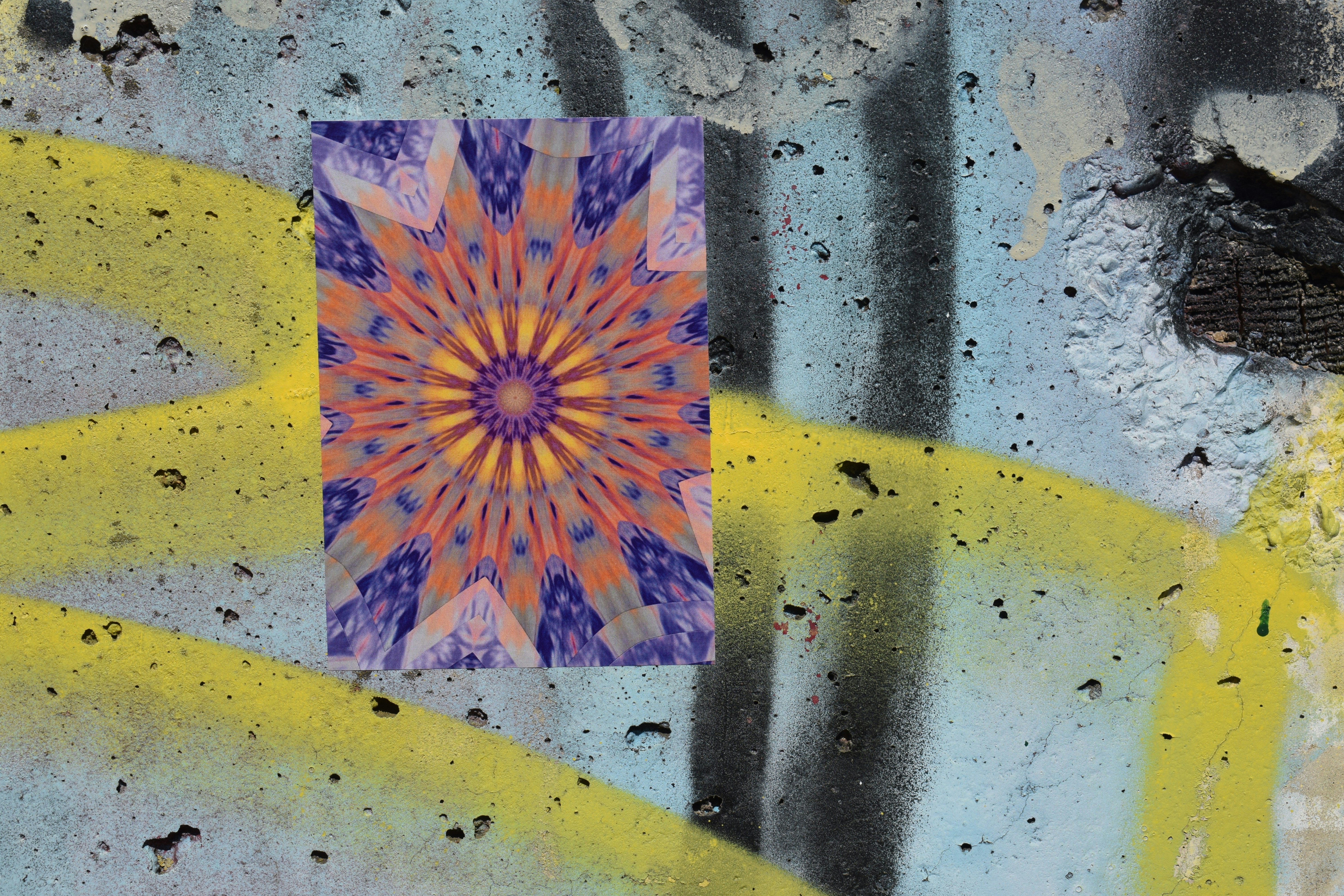 Mandala on Weathered Concrete: A Vivid Centerpiece Amid Graffiti Grunge