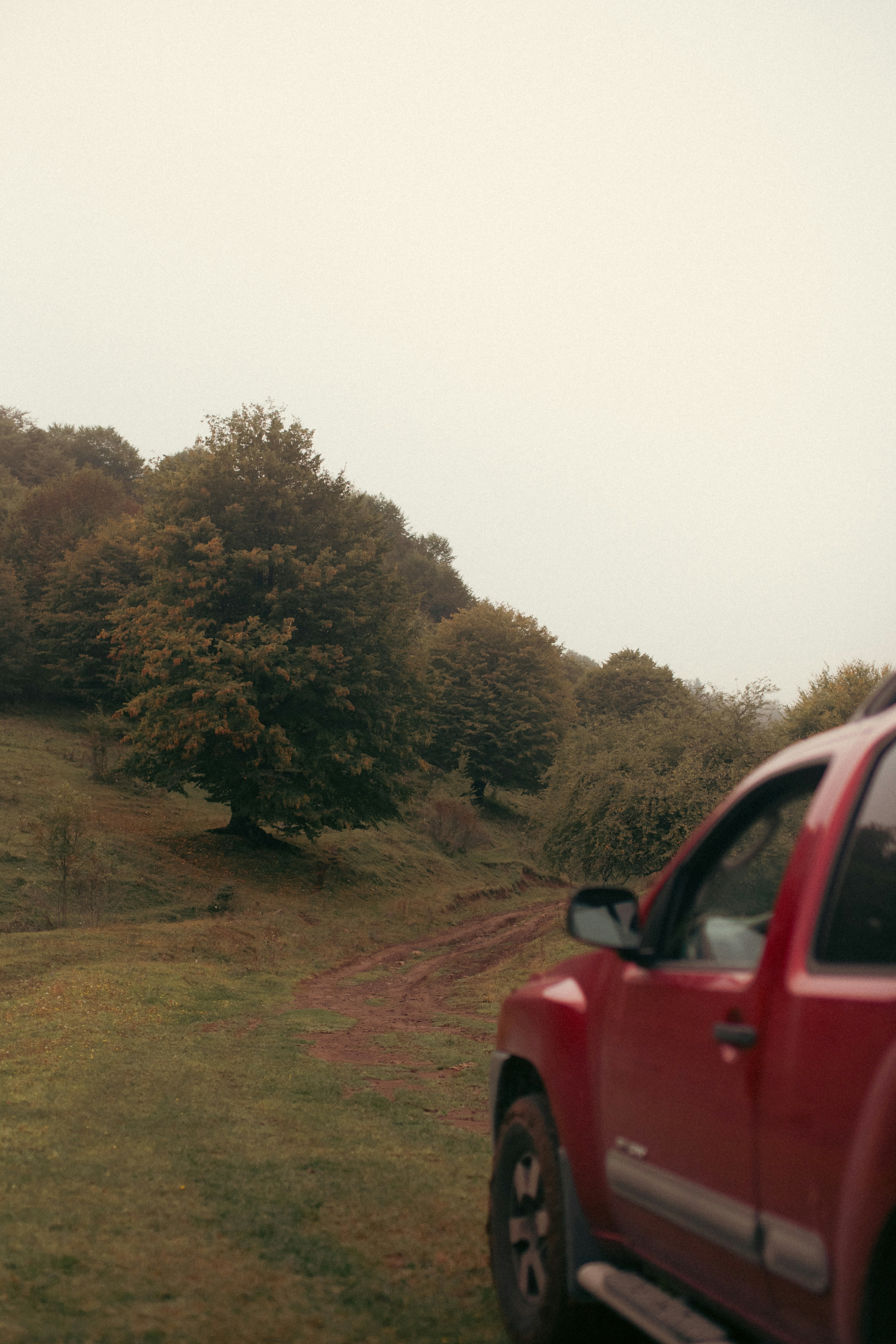 Red Truck at Distant Hill: Quiet Road, Quiet Landscape