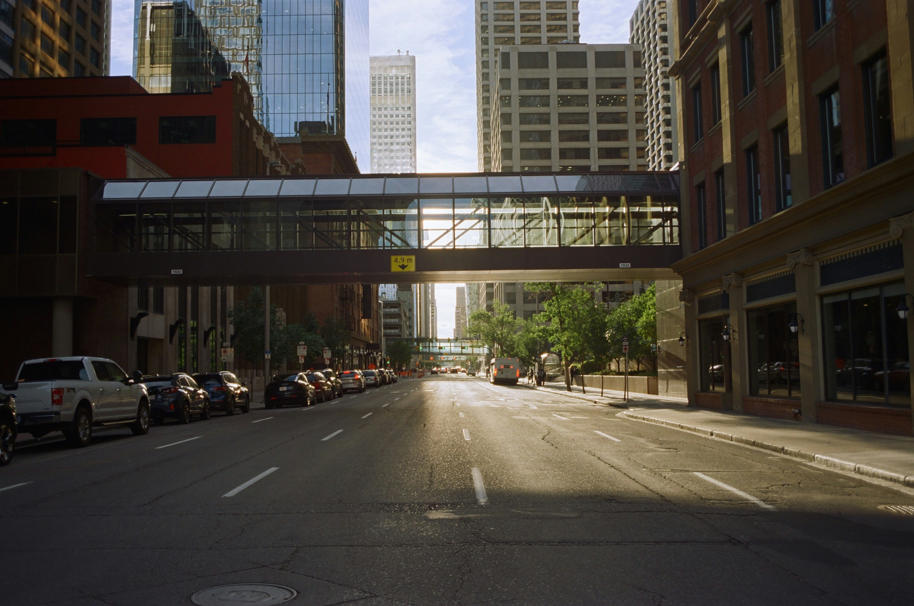A city street with a bridge over it photo – Free Downtown Image on Unsplash