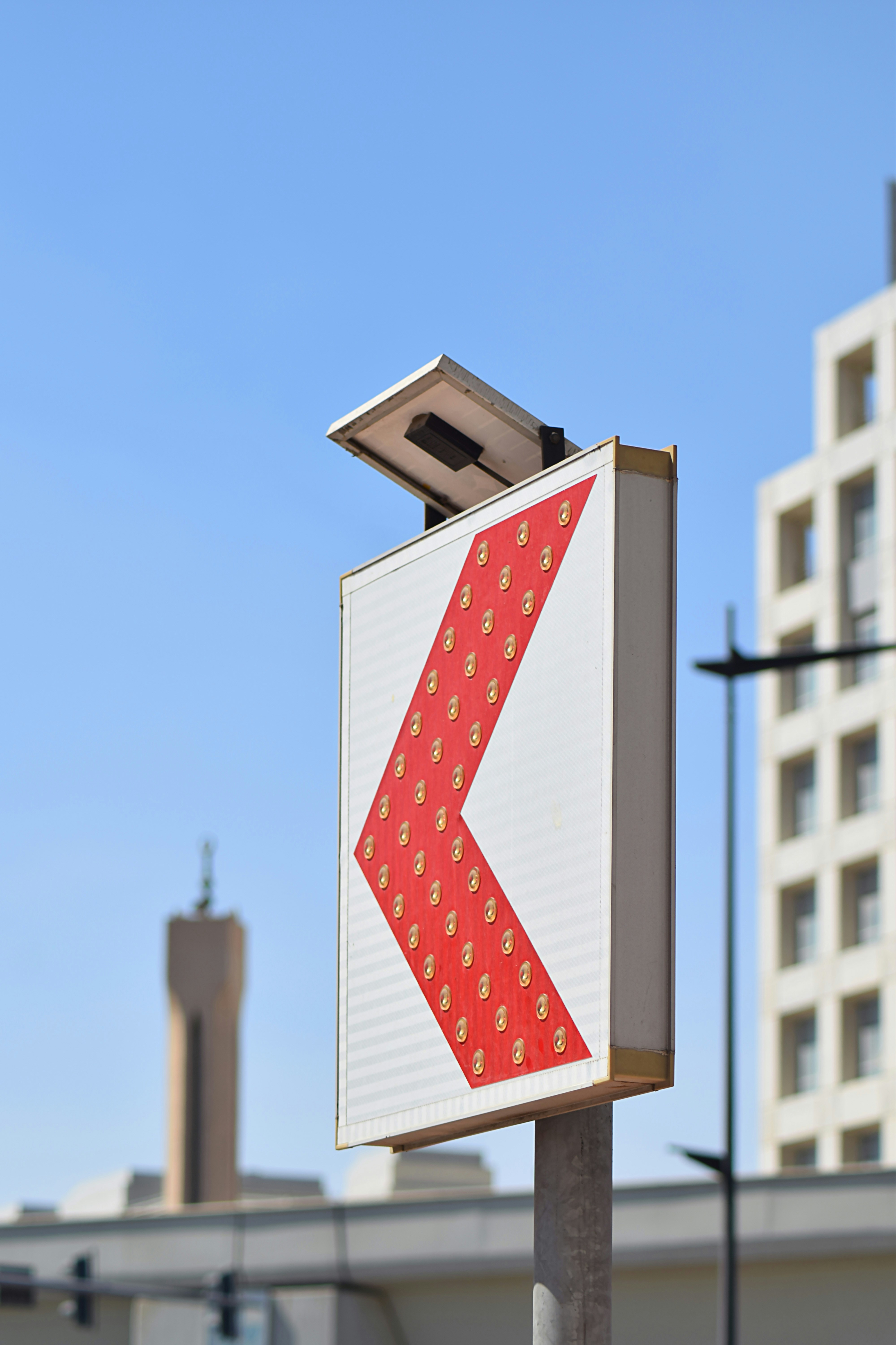 Red Arrow on a Sunlit Urban Canvas