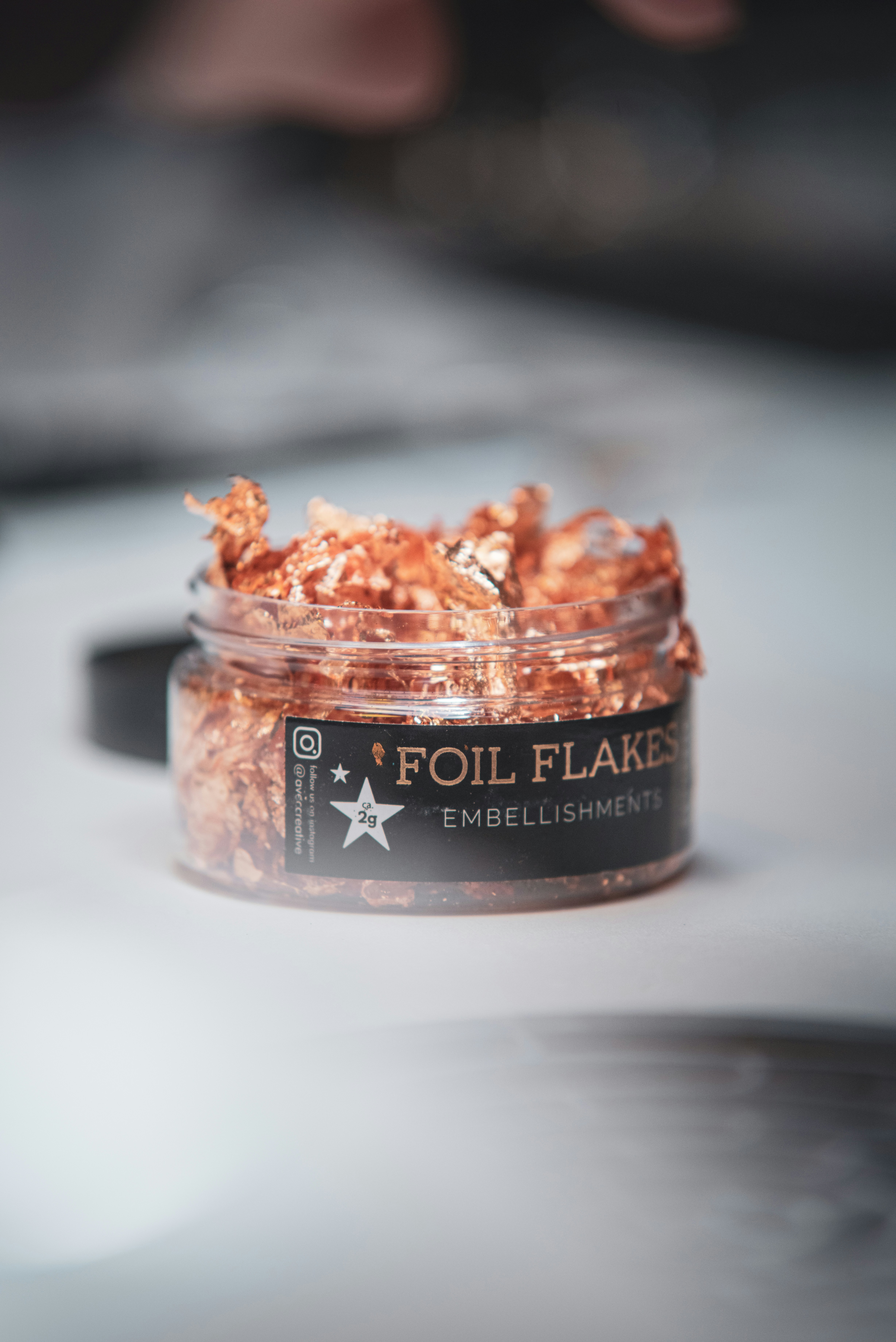 A jar of orange flakes sitting on top of a table photo – Free Teplice ...