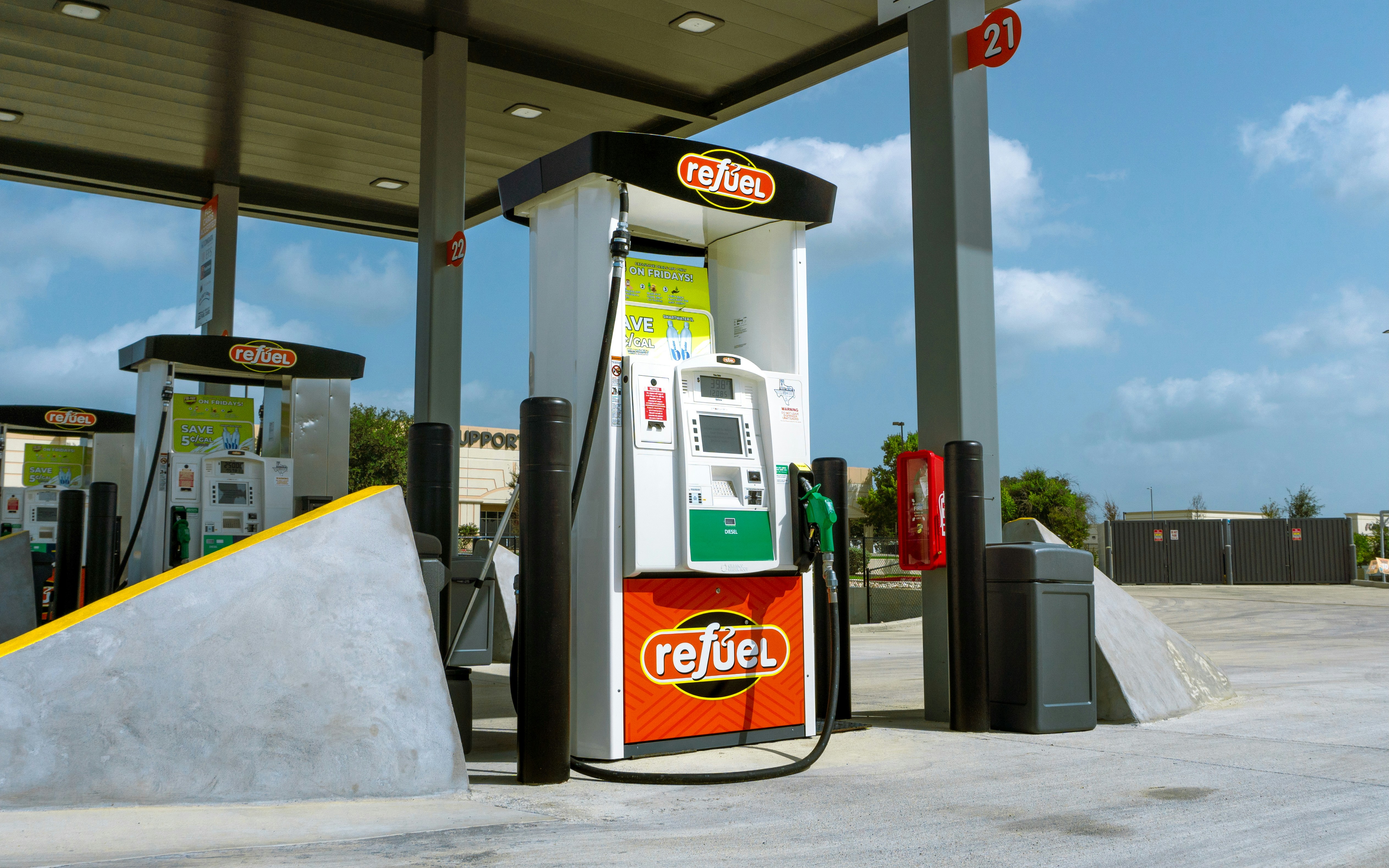 A gas station with gas pumps and a ramp photo – Free Refuel Image on ...