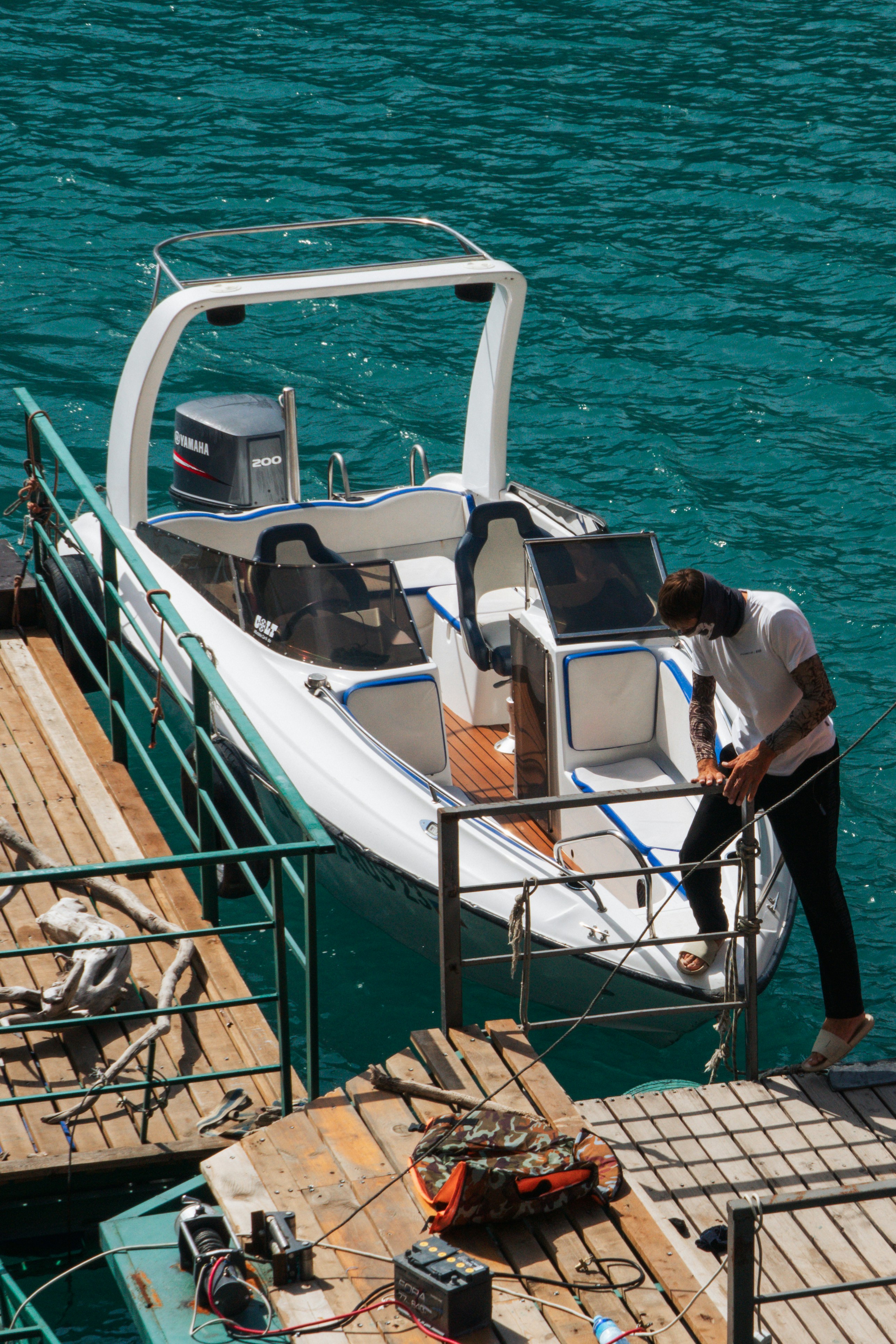Dockside Focus: A Hands-on Moment with a Sleek Speedboat
