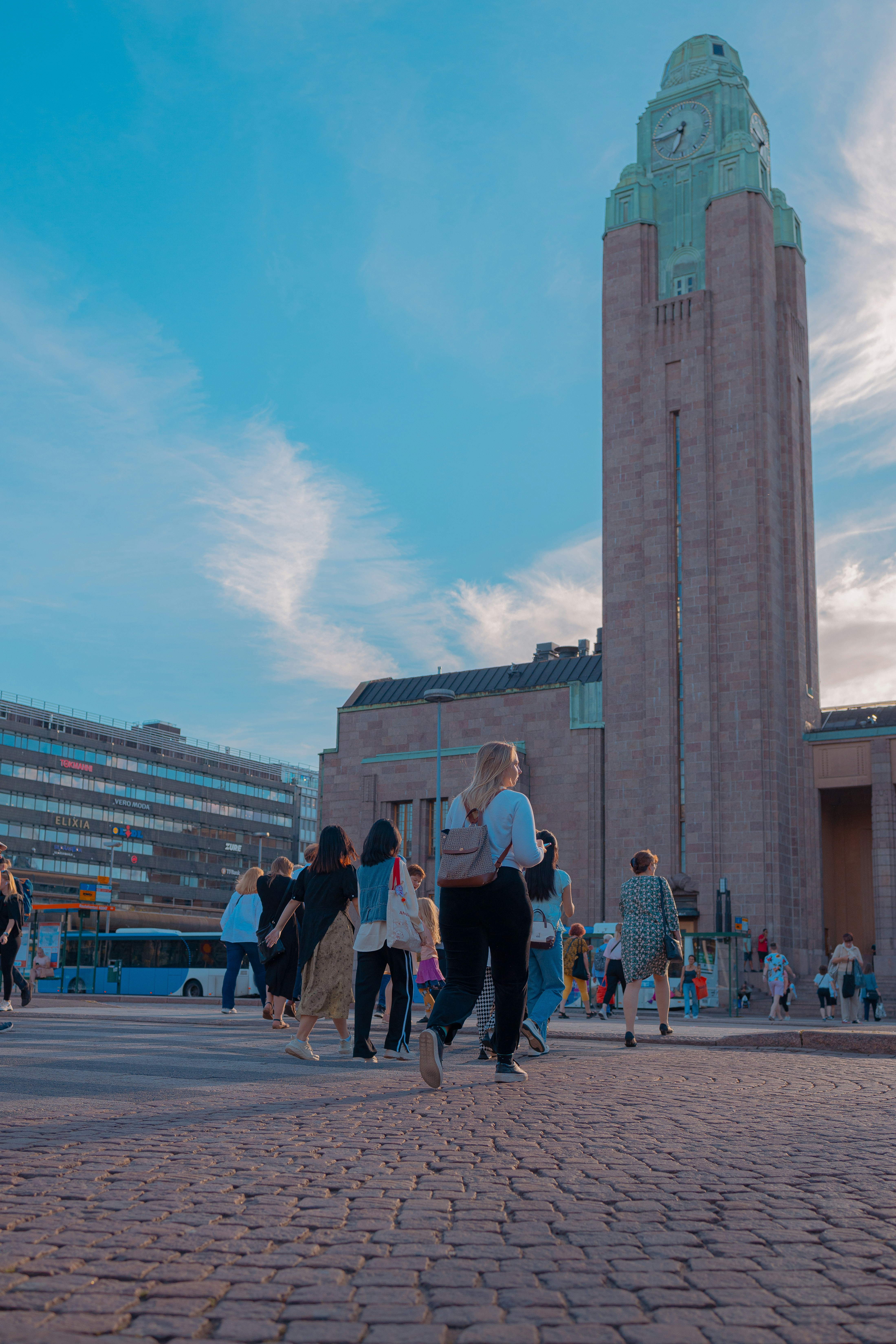 Flowing Footsteps Toward the Green-Topped Clock Tower