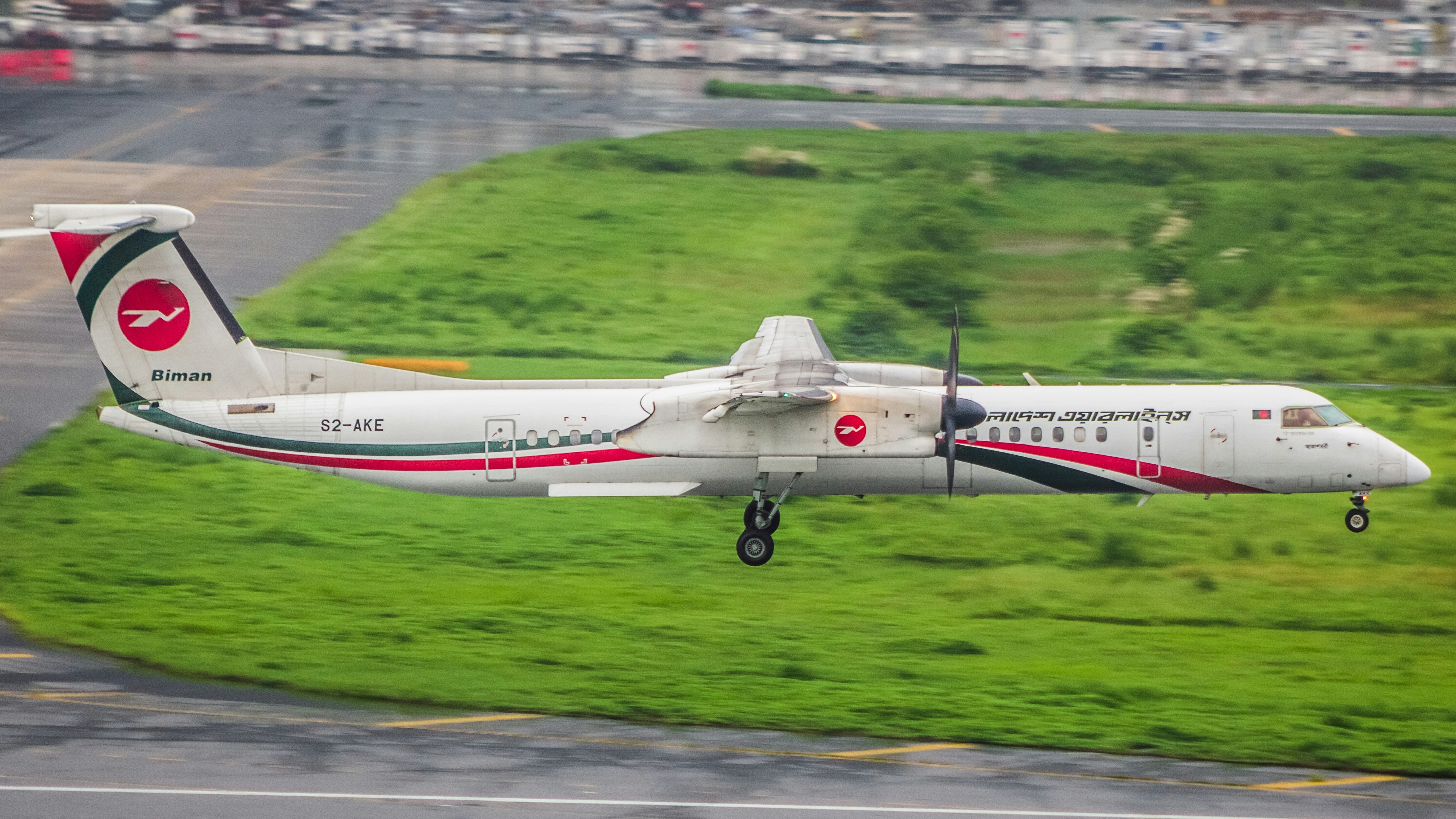 Final Approach Over a Lush Runway: Biman Bangladesh Dash 8 Q400