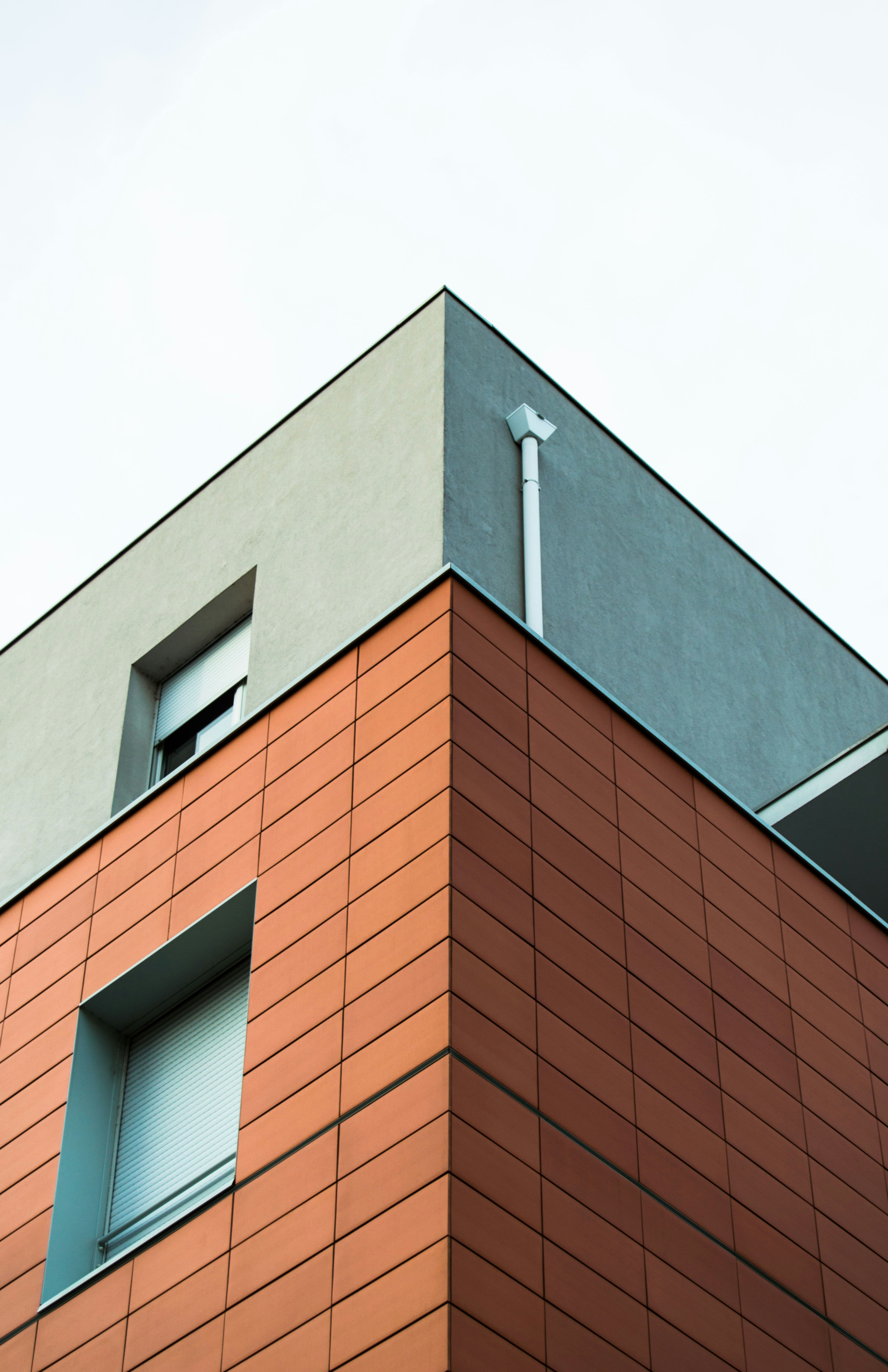 A tall orange building with a sky background photo – Free Lyon Image on ...