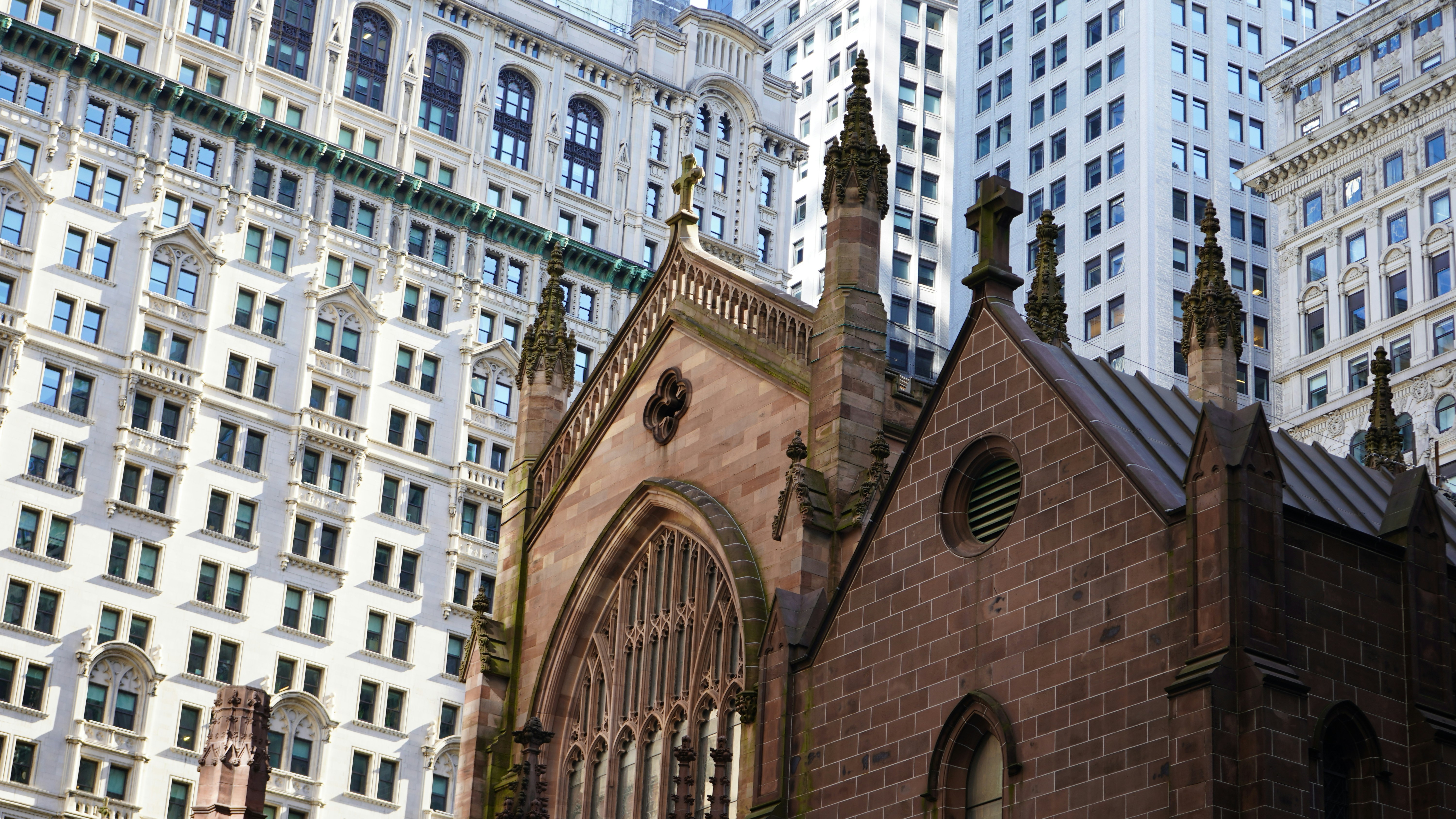 A church in a city surrounded by tall buildings photo – Free New york ...