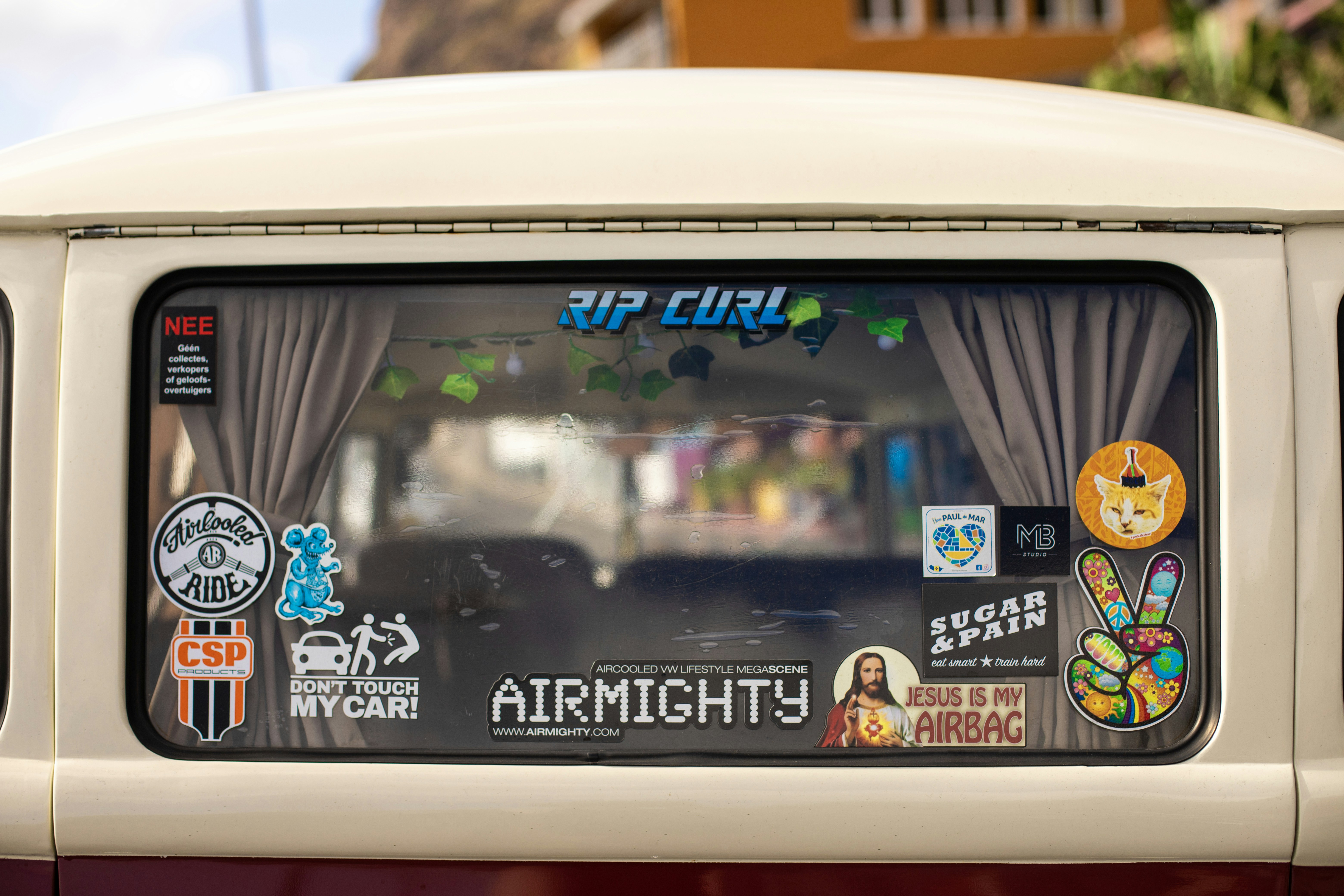 Sticker Mosaic on a Vintage Van's Rear Window
