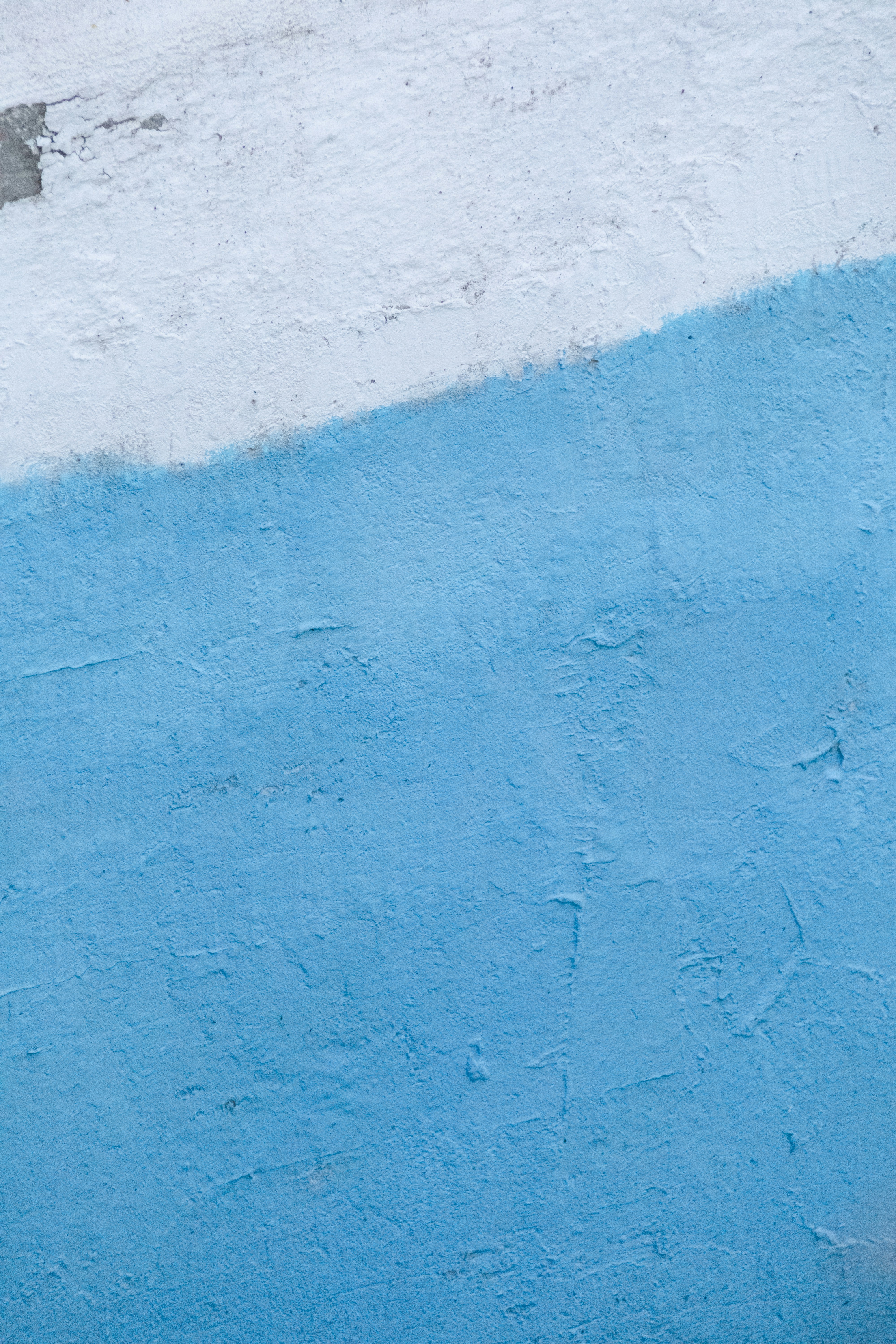 A man riding a skateboard down the side of a wallFilipe Nobre