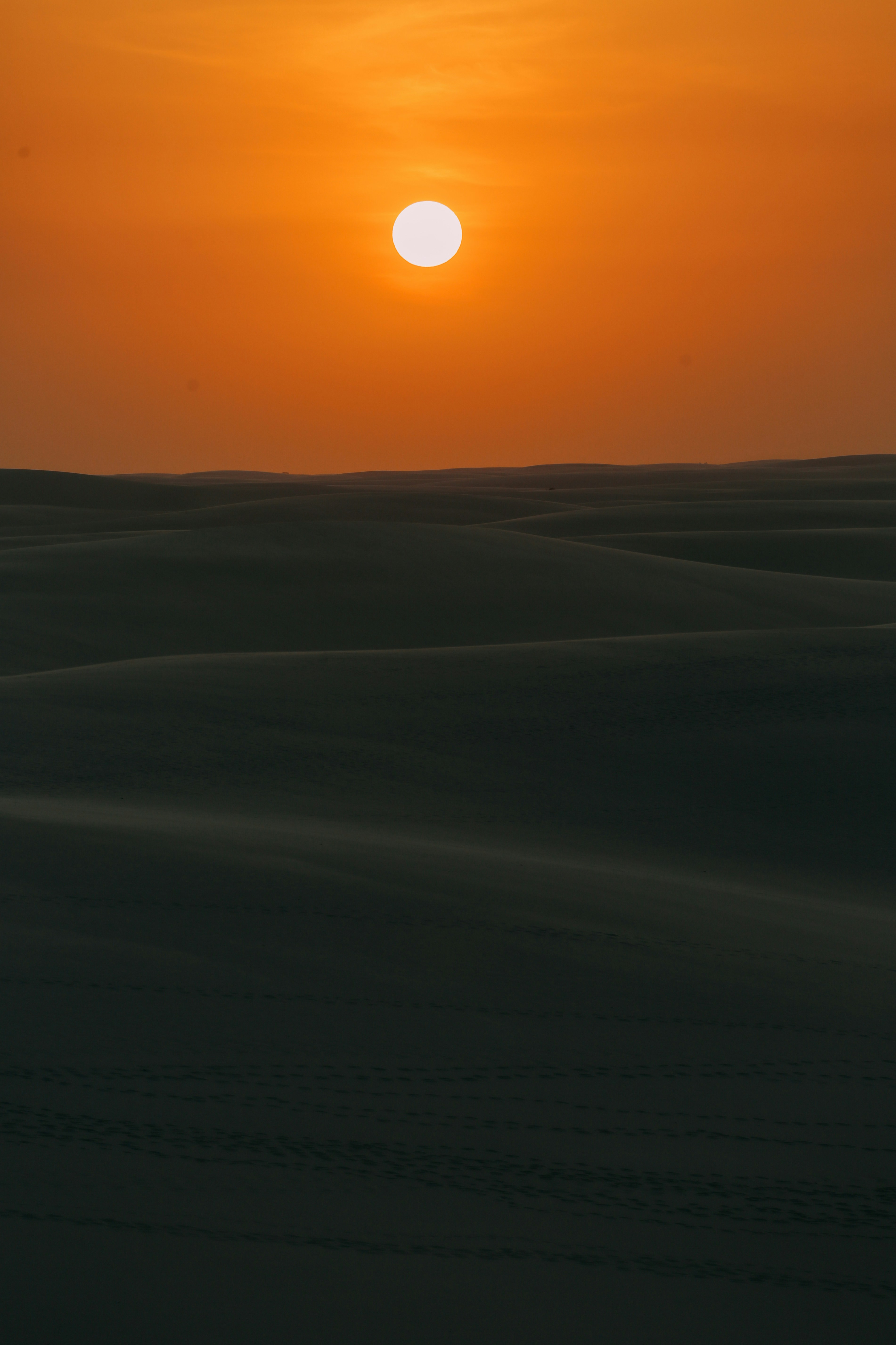 Sun Crest over Velvet Dunes at Dusk
