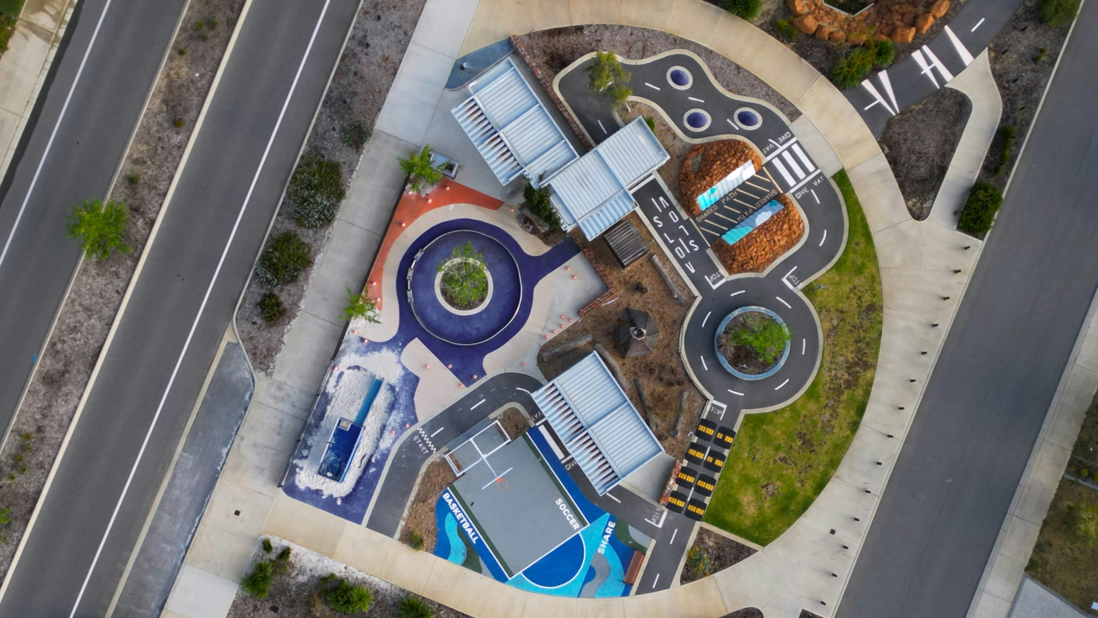 Aerial view of a children's park on a new housing development | An aerial view of a parking lot in a city
