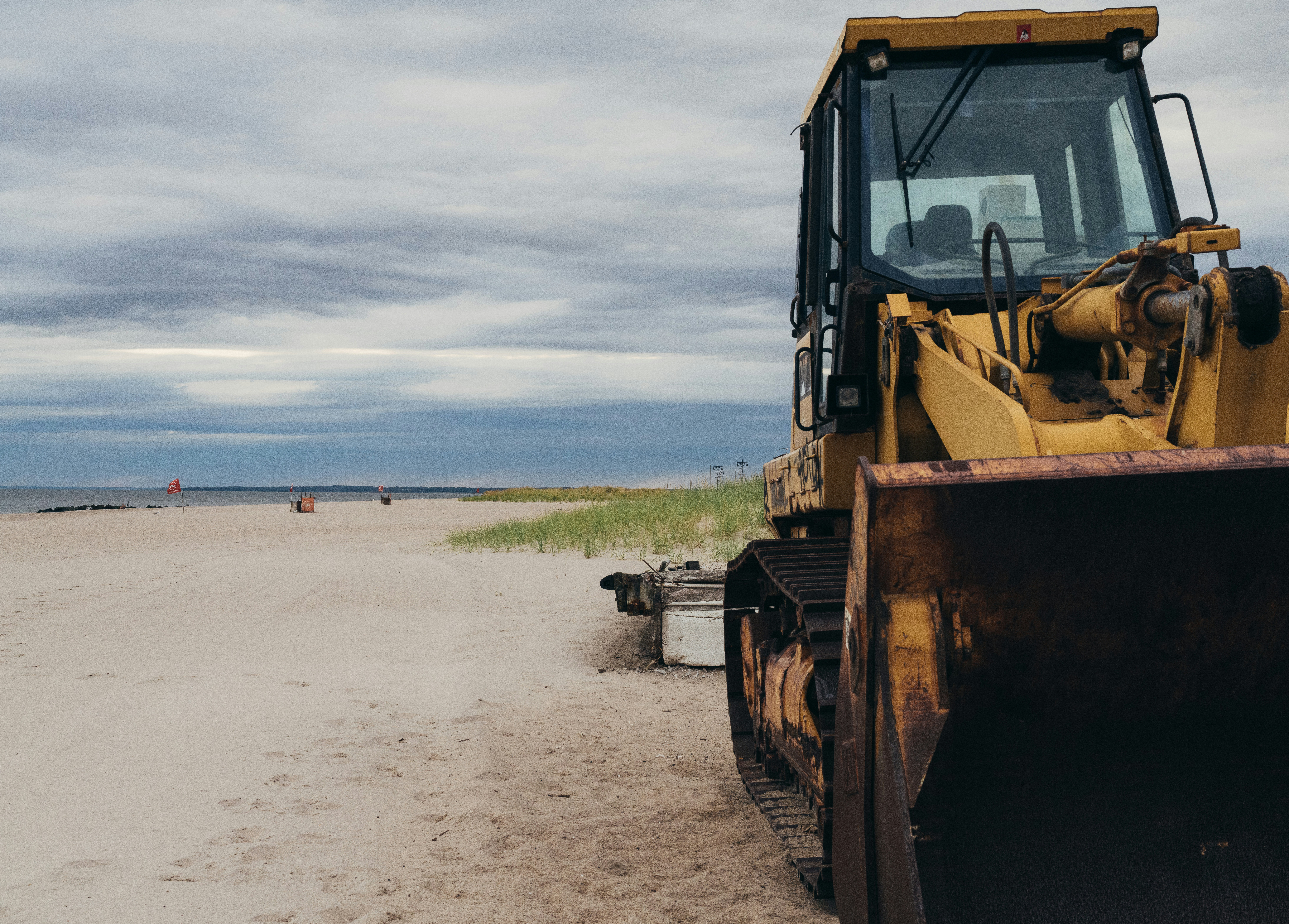 Dungaree of the Dunes: A Front-Row View of a Bulldozer at the Beach